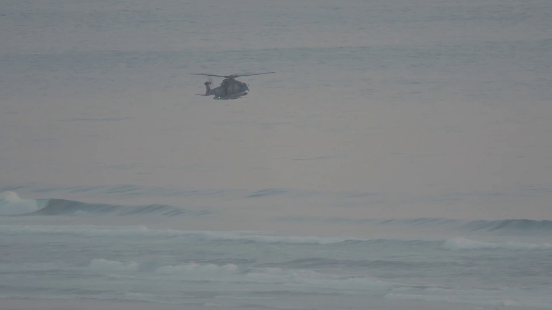 Helicopter Flying Over Ocean Waves In Cloudy Stock Footage SBV ...
