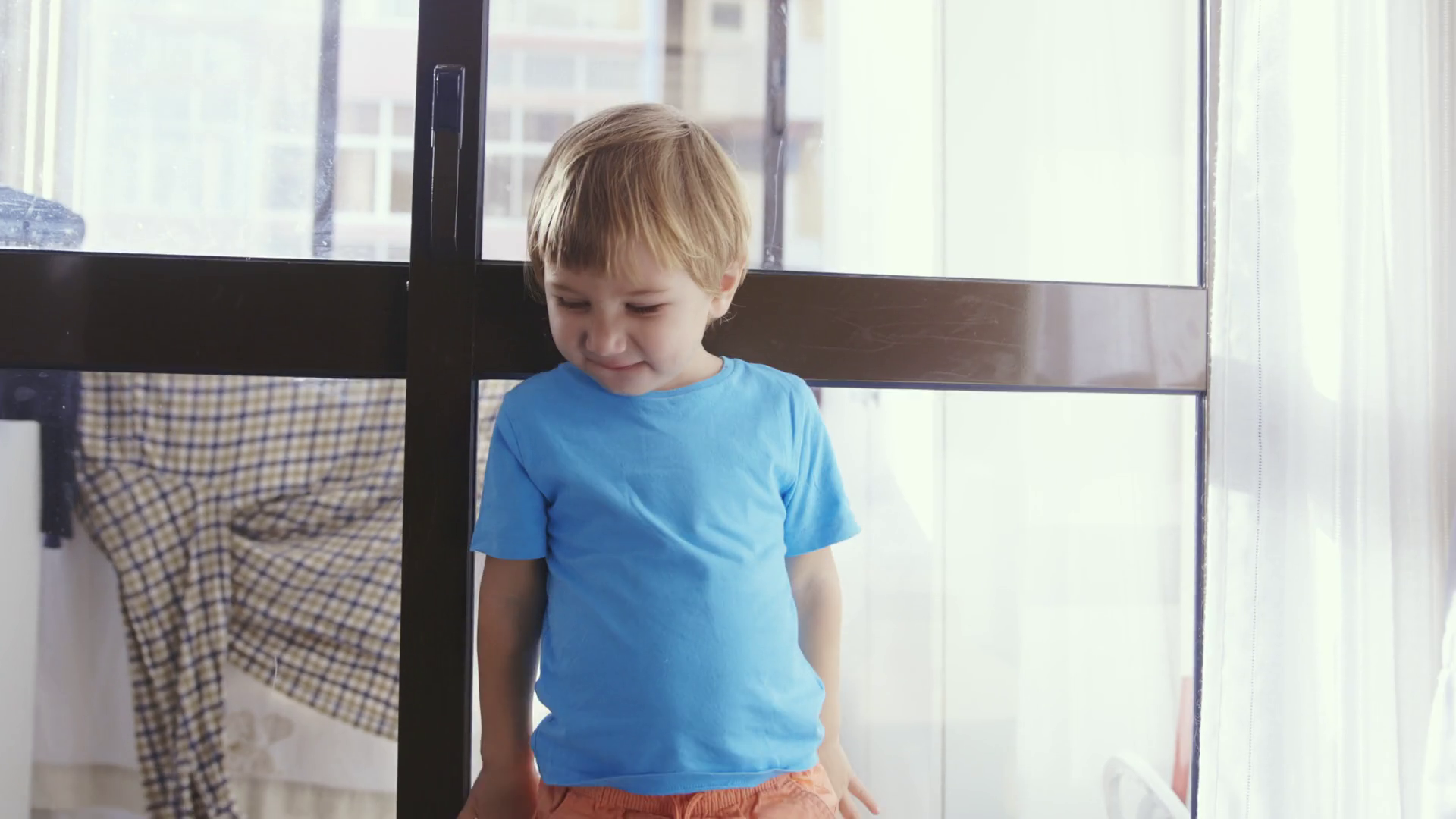 A Curious Little Boy Gazing Out Window Stock Footage SBV-348635428 ...