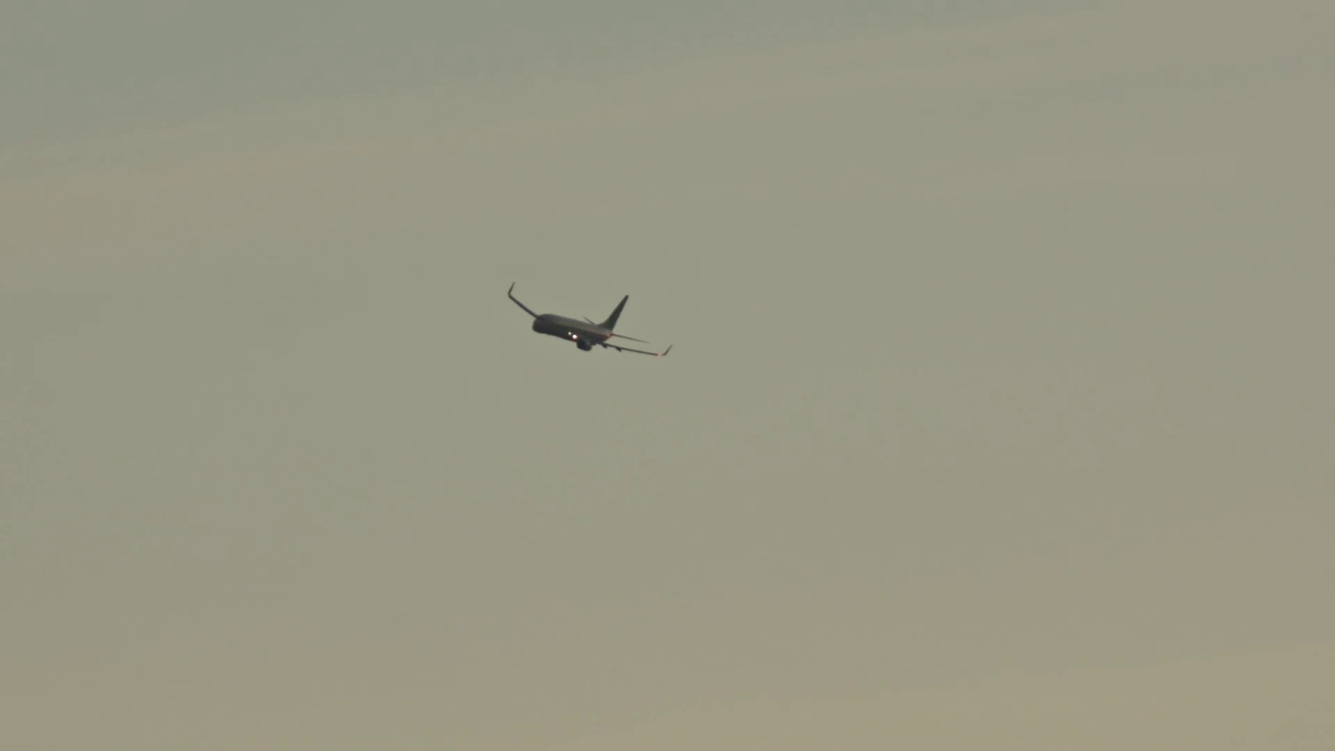 Airplane Flying In Hazy Sky During Daylight Stock Footage SBV-348700039 ...