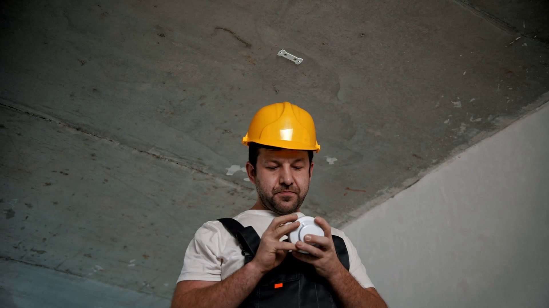 A Man Setting Fire Alarm On Top Of Draft Room Stock Footage SBV ...