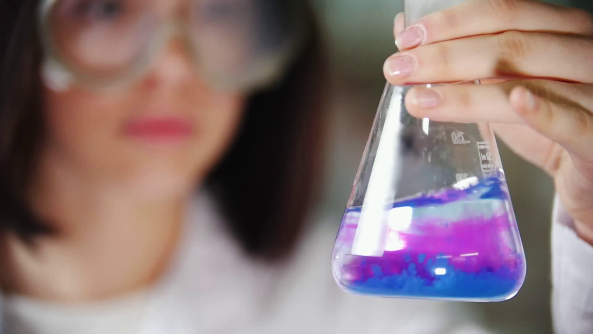 A Woman Mixing Flask With Chemical Substance Stock Footage SBV ...