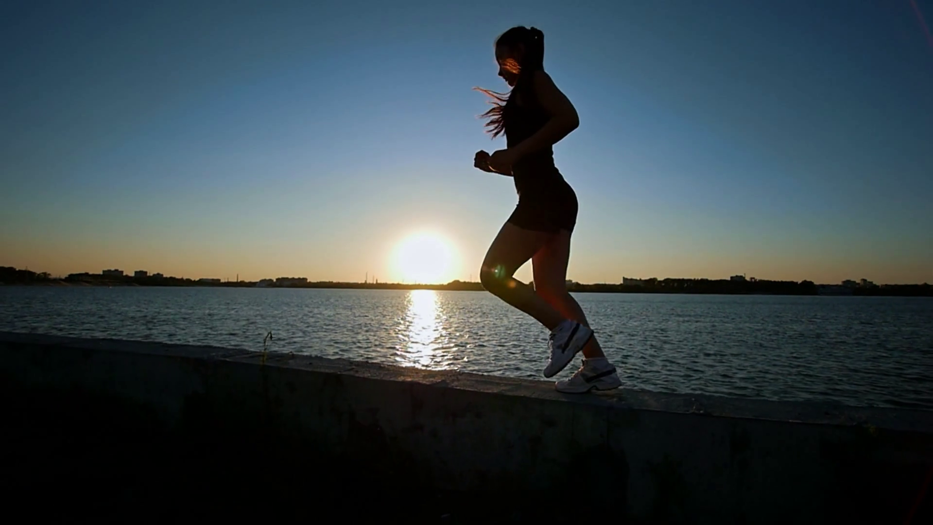 Graceful Runner On Waterfront Stock Footage SBV-325712695 - Storyblocks