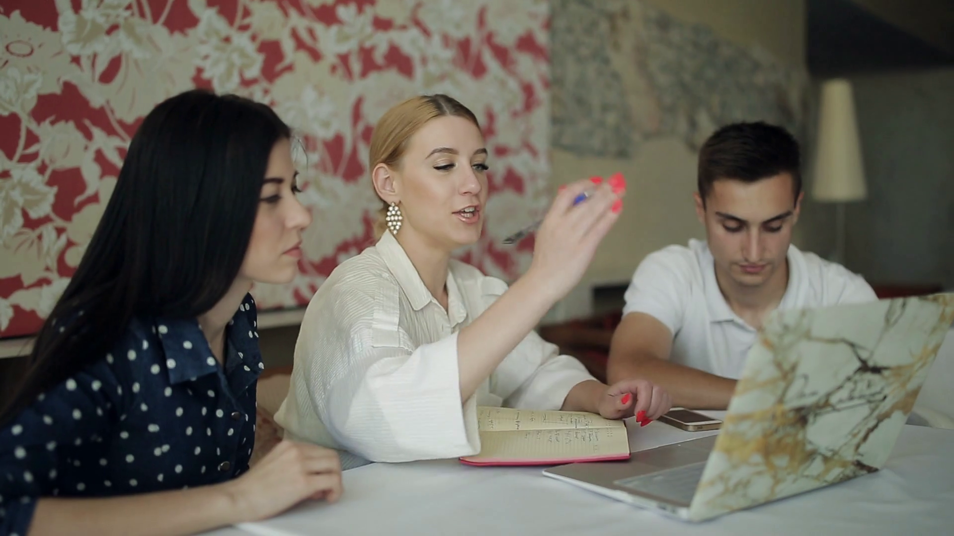 A representative of the wedding planners, talking with clients about ...