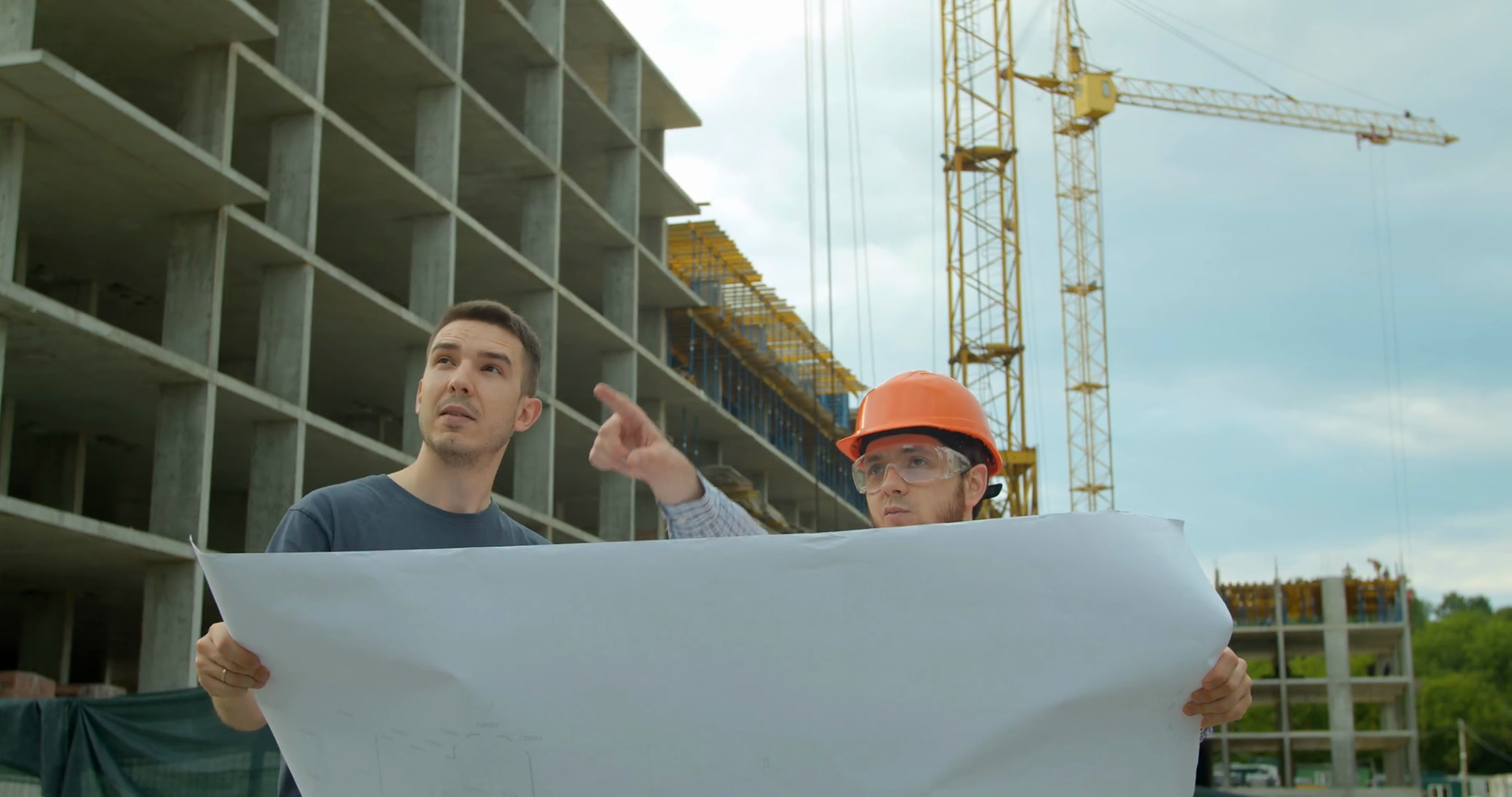 Builder With Male Client Near Building Under Stock Footage SBV ...
