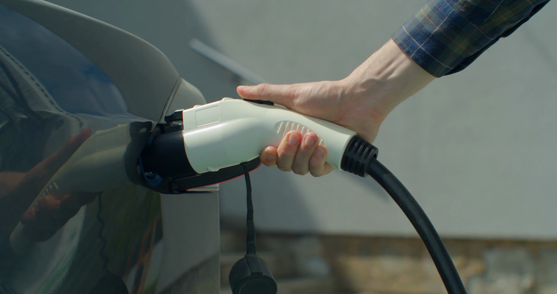 Man Plugging In Electric Car At Home At Stock Footage SBV-338406850 ...