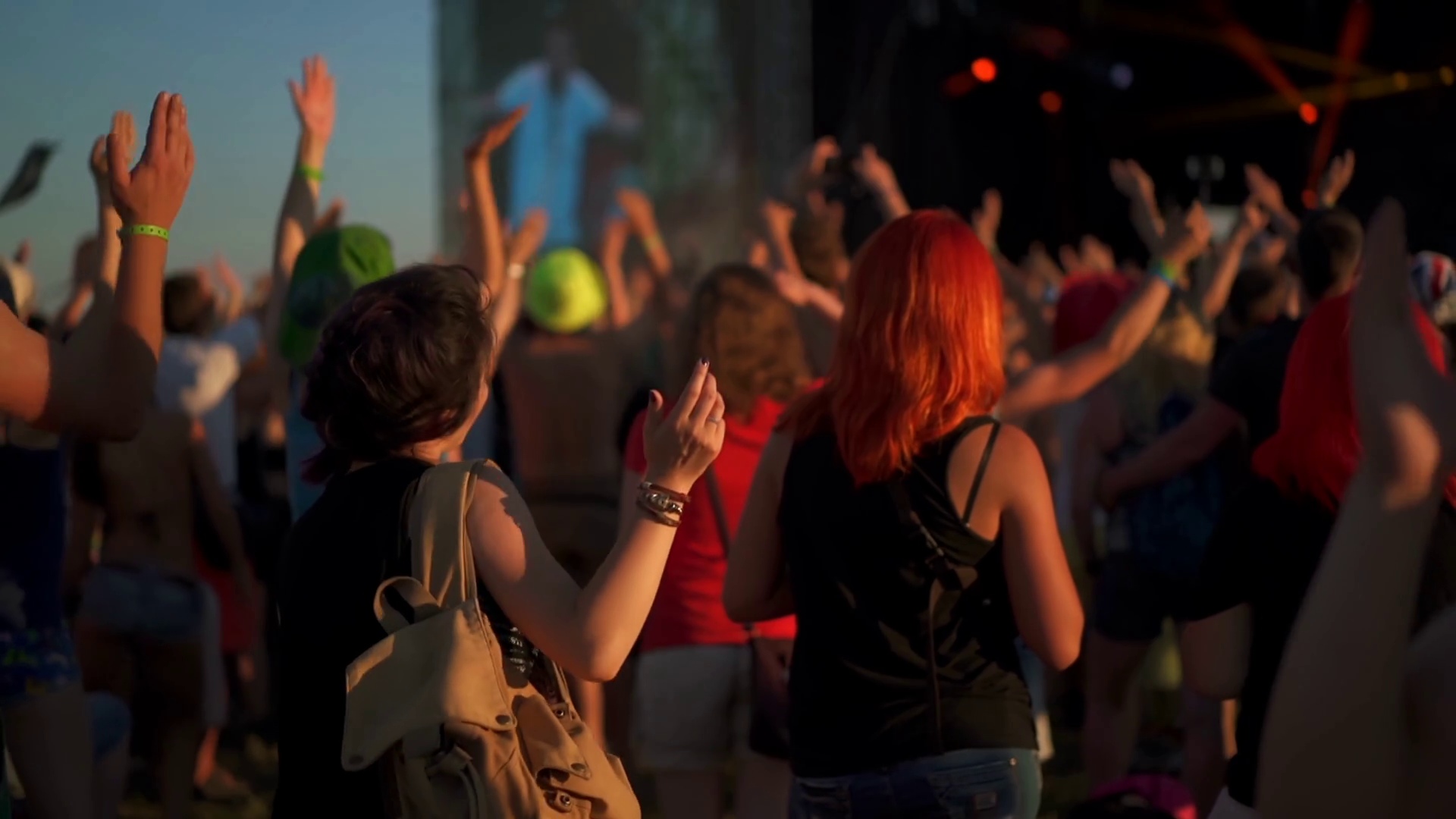Crowd of people enjoying the concert. Sunset light and smoke at rock ...