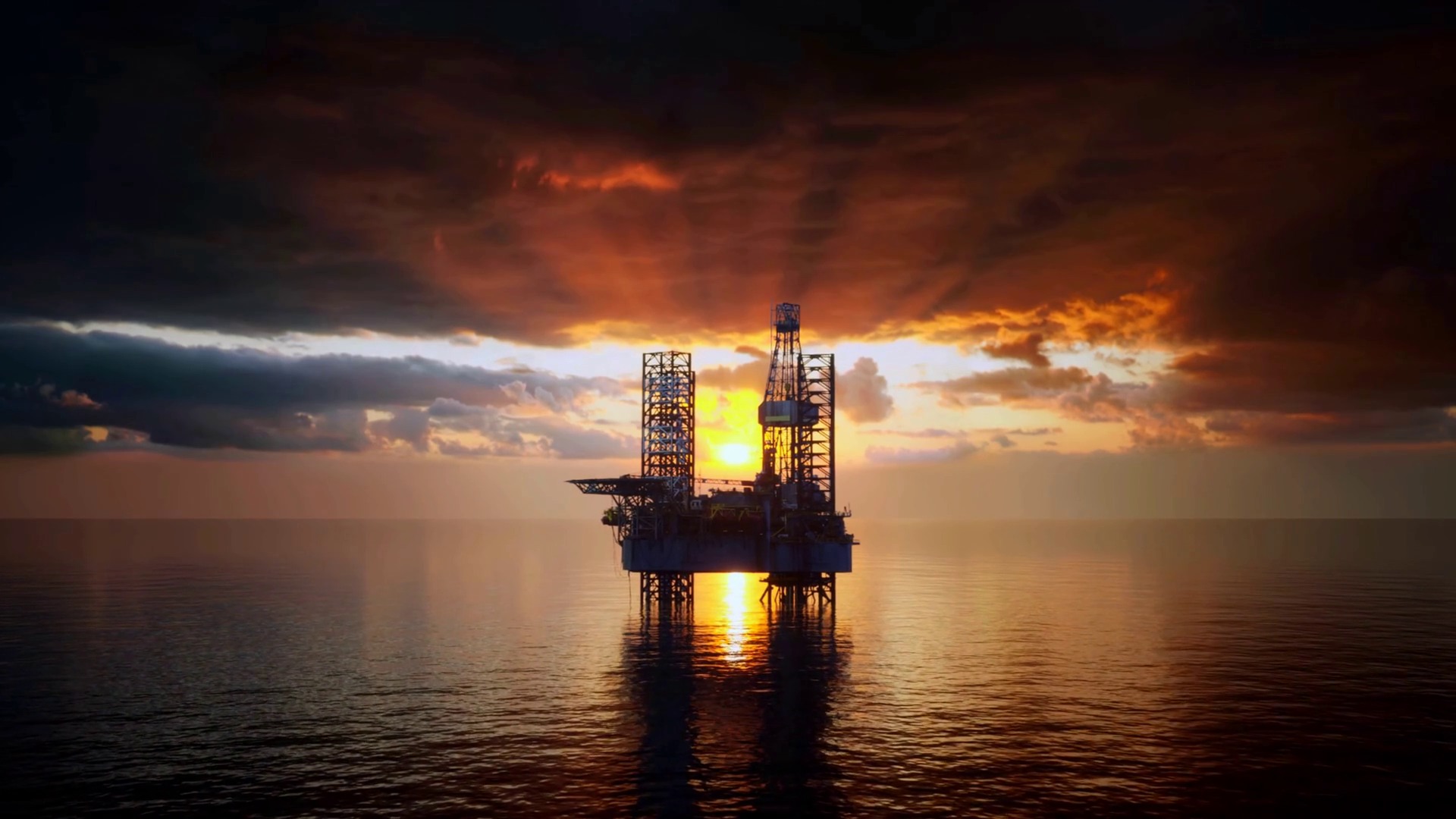 Moving over the ocean waves at sunset towards the silhouette of an ...