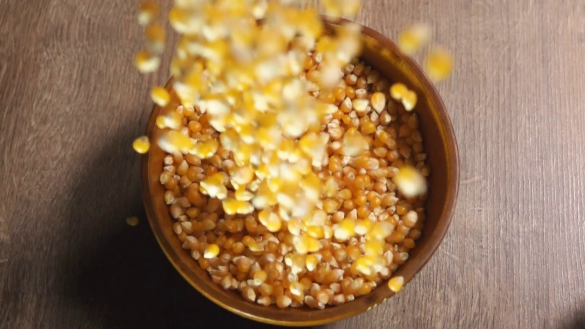 Pop corn pouring into a bowl Stock Video Footage - Storyblocks
