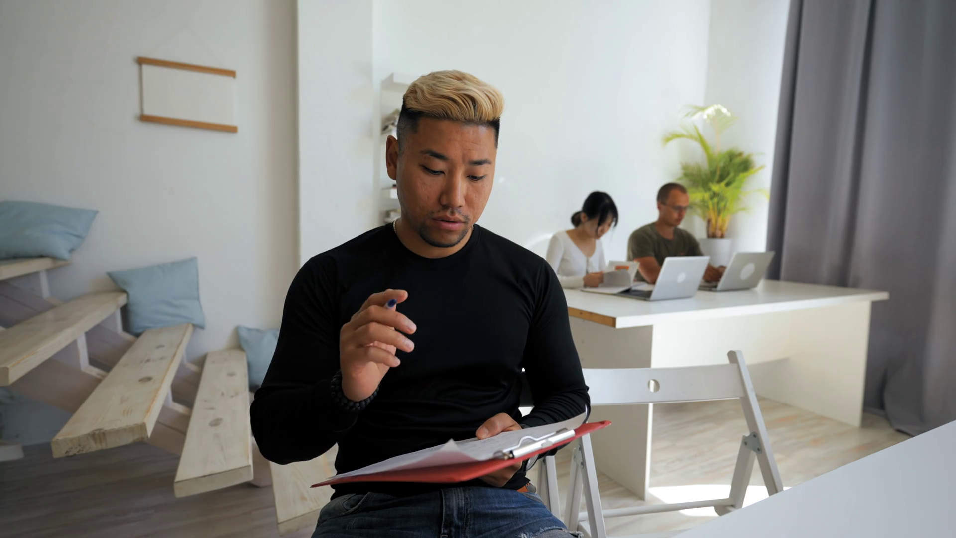 Asian man conducts online job interview making notes Stock Video ...