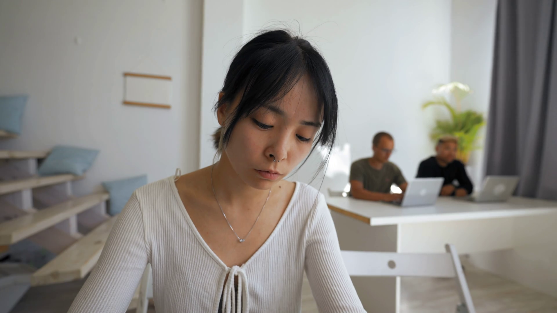 Asian woman writes details of project at call with client Stock Video ...