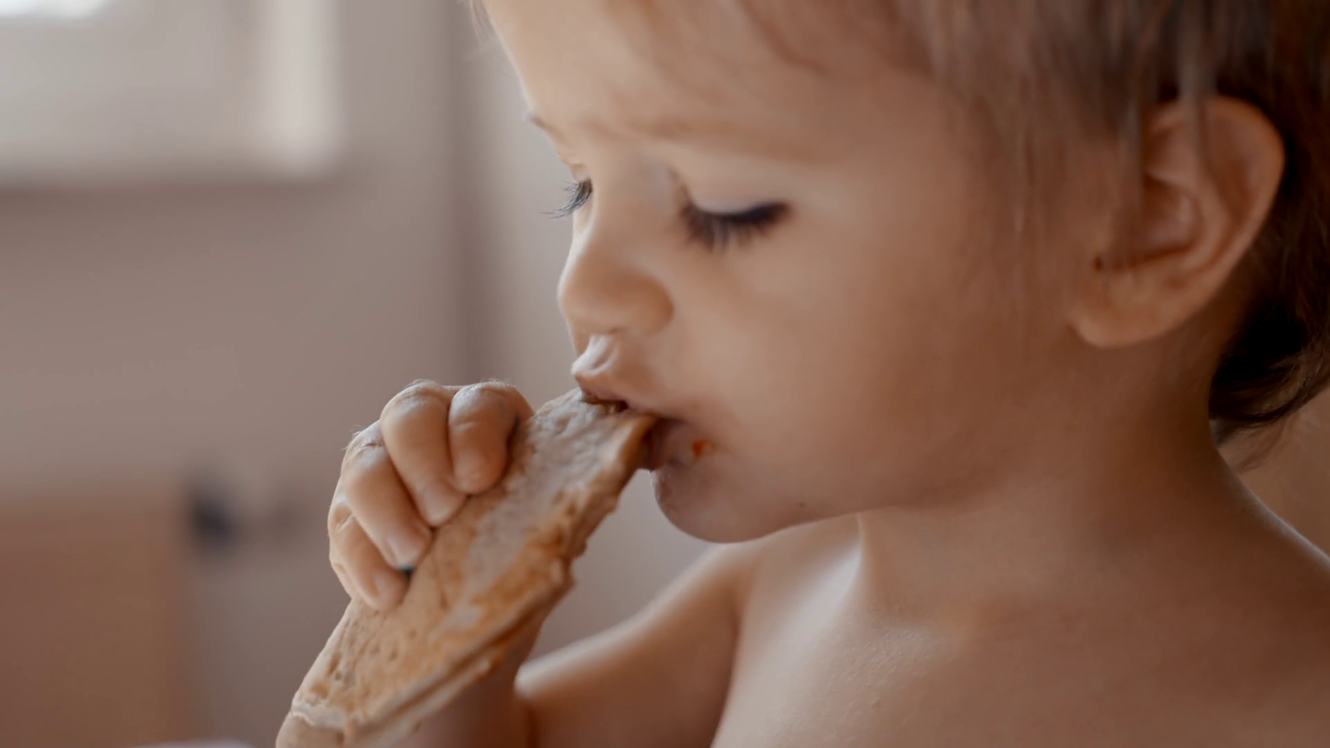A Video Of Young Child Eating Piece Of Food Stock Footage SBV-348801766 ...