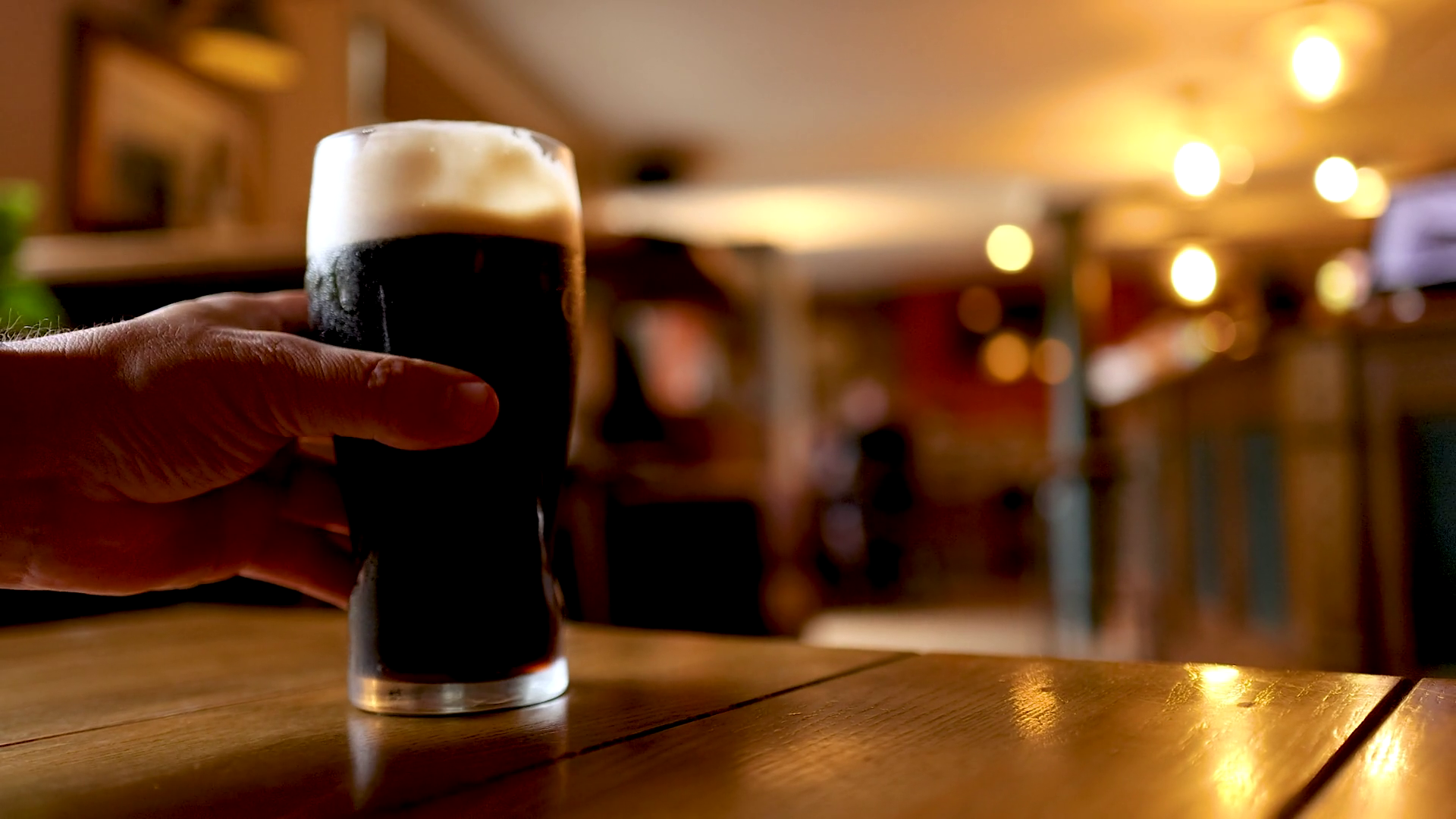 Hand Grabbing Pint Of Stout Stock Footage SBV-352703670 - Storyblocks