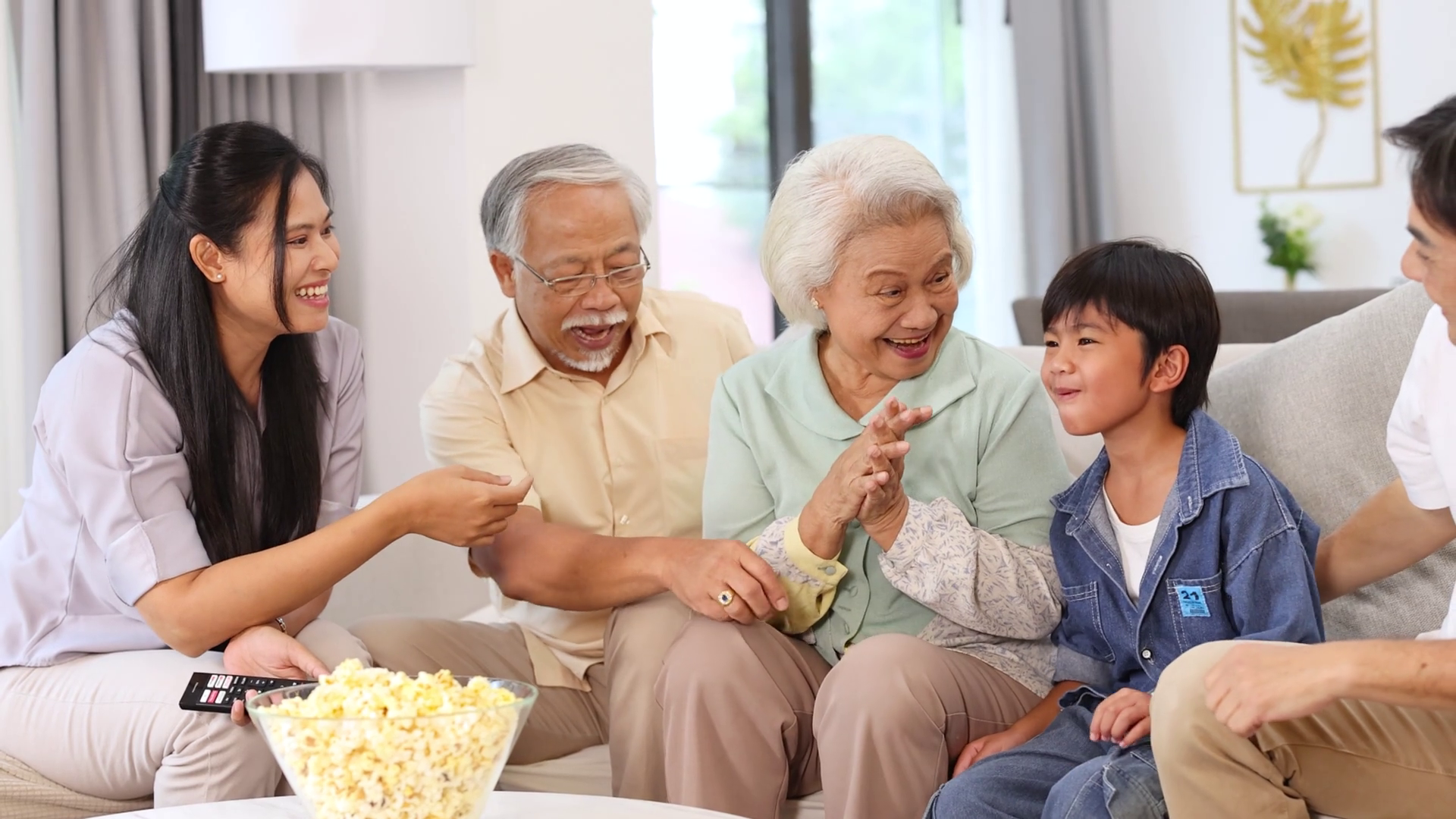 Family Enjoying Popcorn Laughter Together Stock Footage SBV-352544433 ...