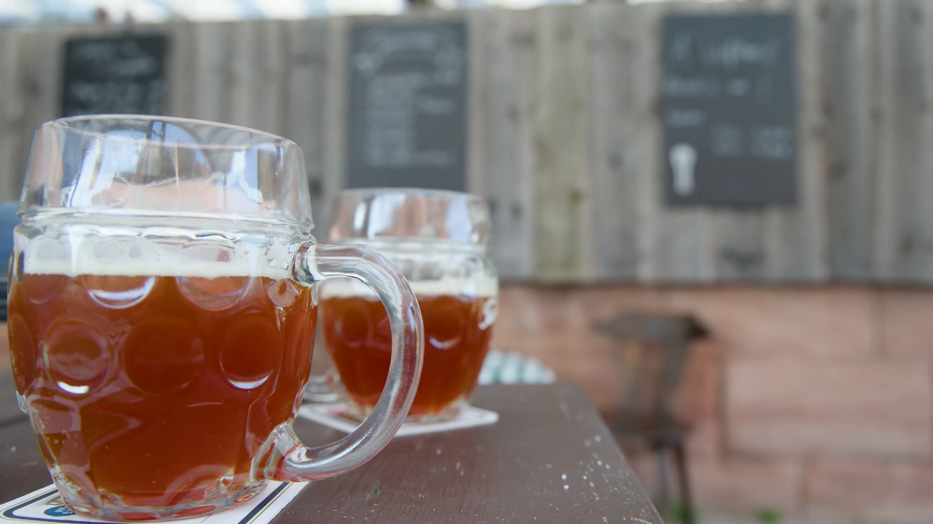 Two Beer Mugs On Outdoor Table In German Stock Footage SBV-353555414 ...