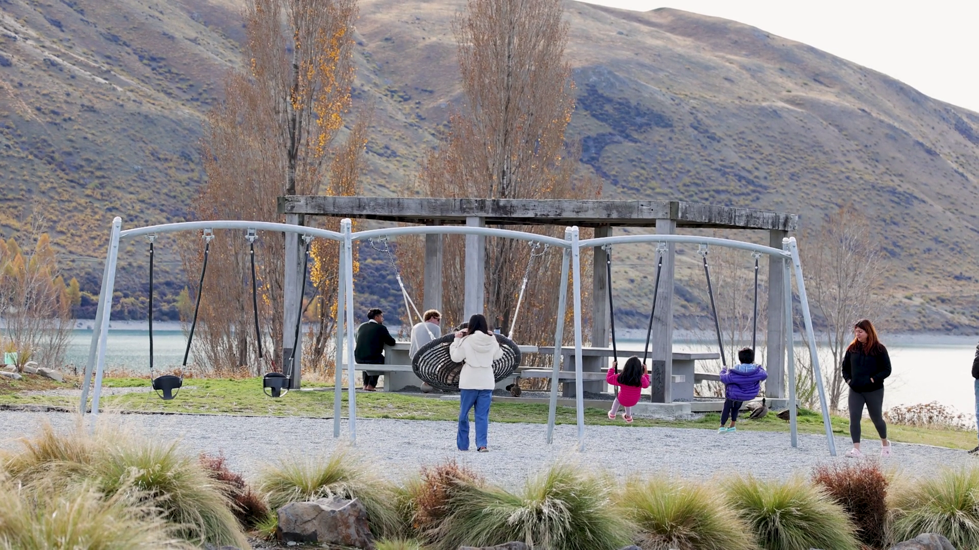 Family Enjoying Swings At Lake Tekapo Stock Footage SBV-352446965 ...