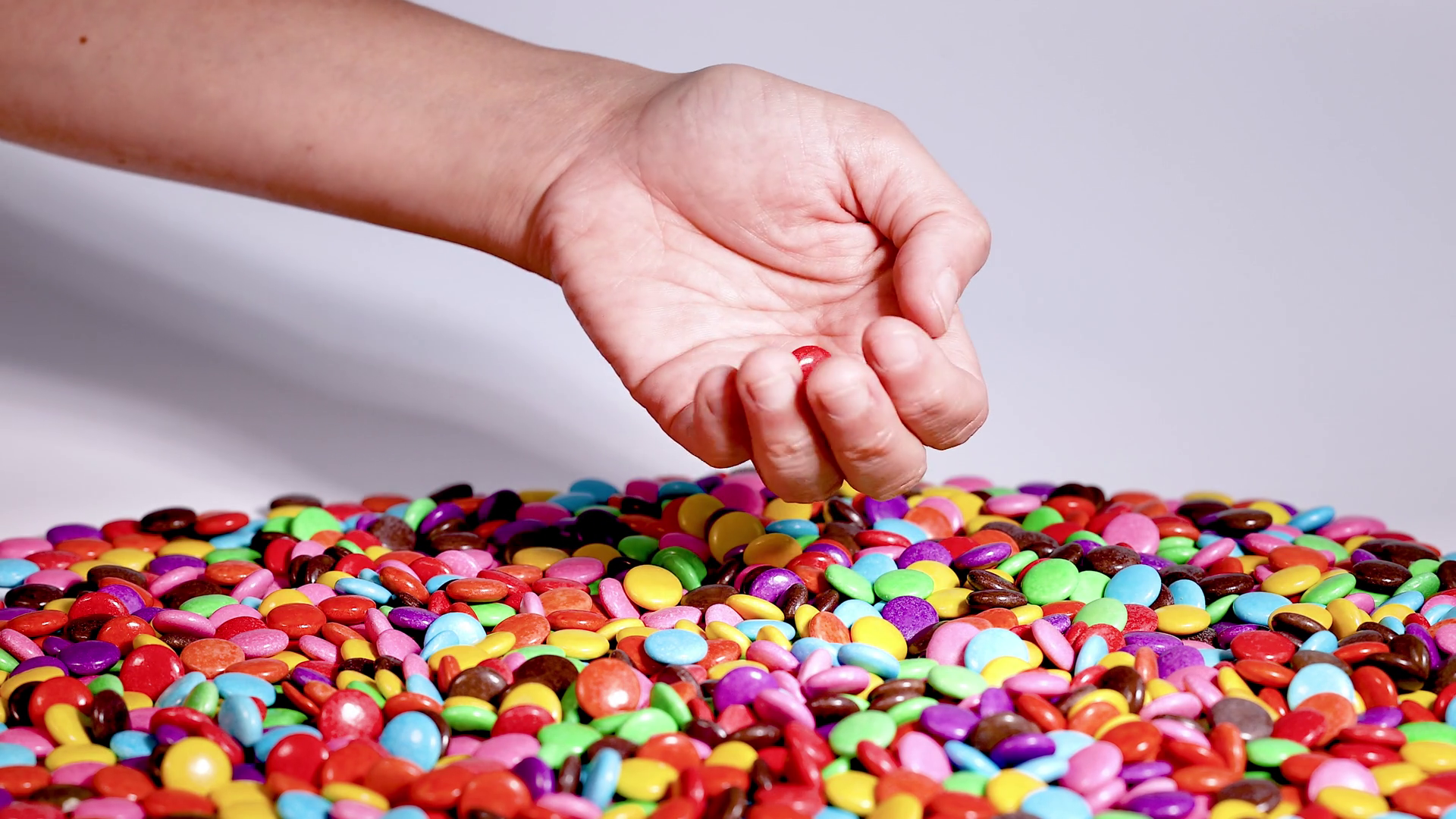 Hand Picking Colorful Candy Pieces Stock Footage SBV-352765587 ...