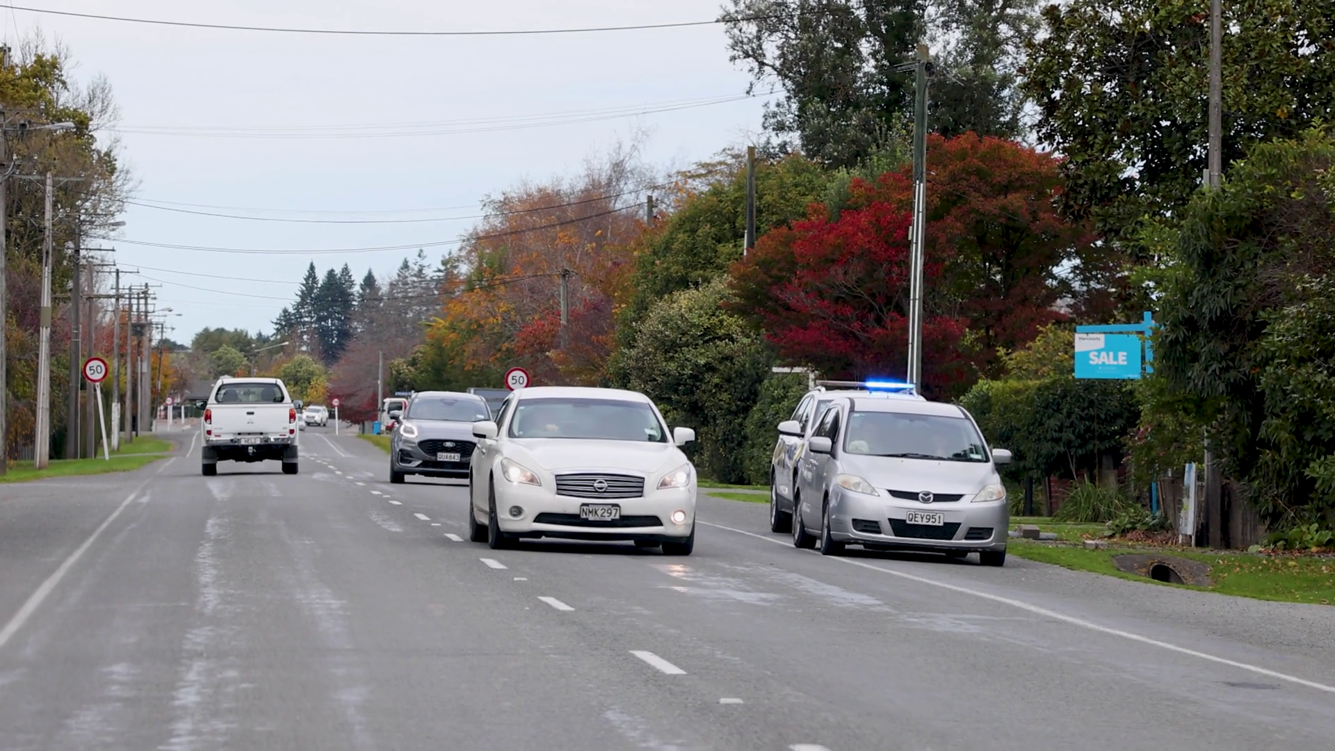 Police Car Civilian Vehicles Driving Down Stock Footage SBV-352516334 ...