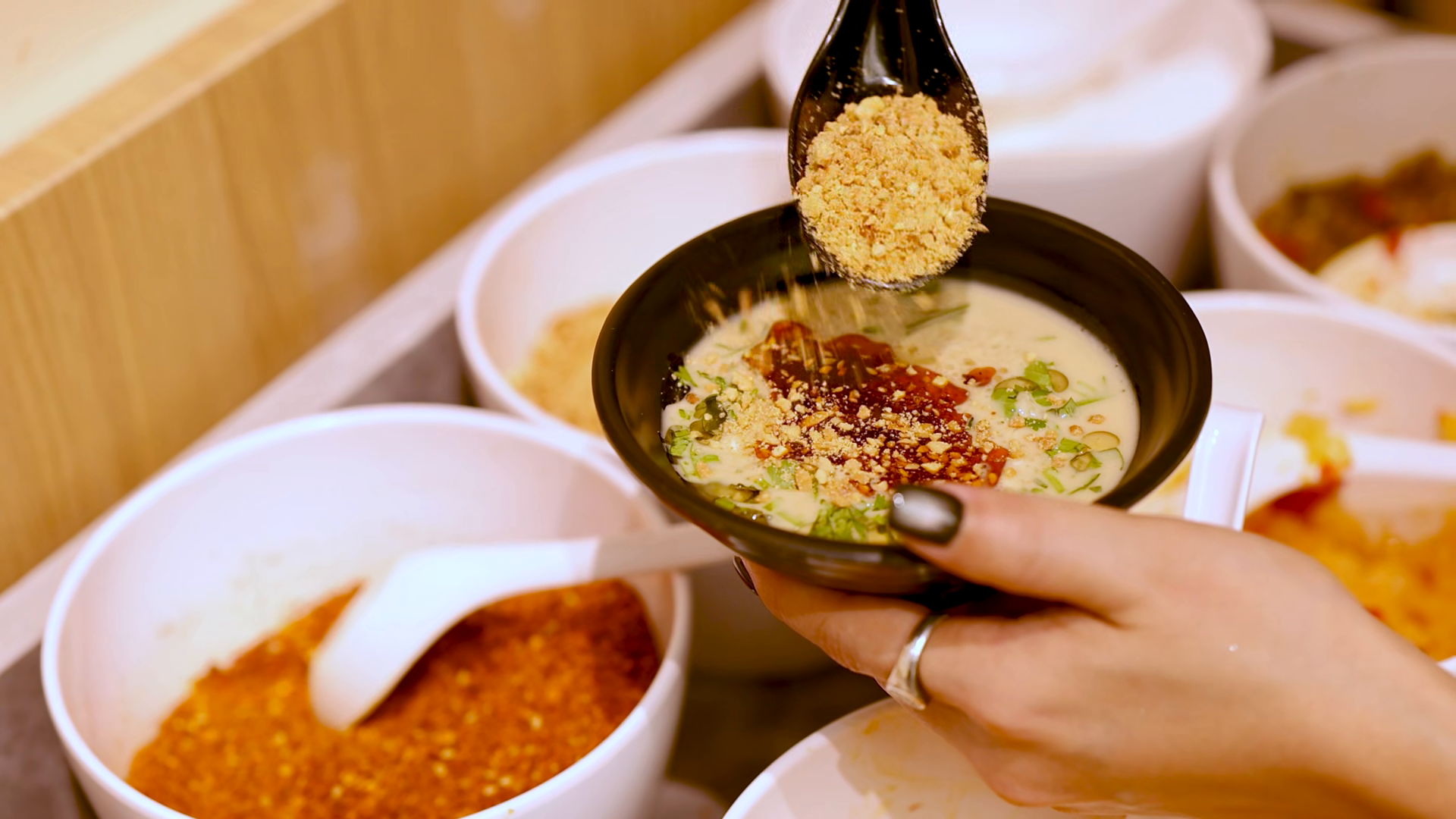 Adding Sesame Chili Toppings At Hot Pot Stock Footage SBV-353596049 ...