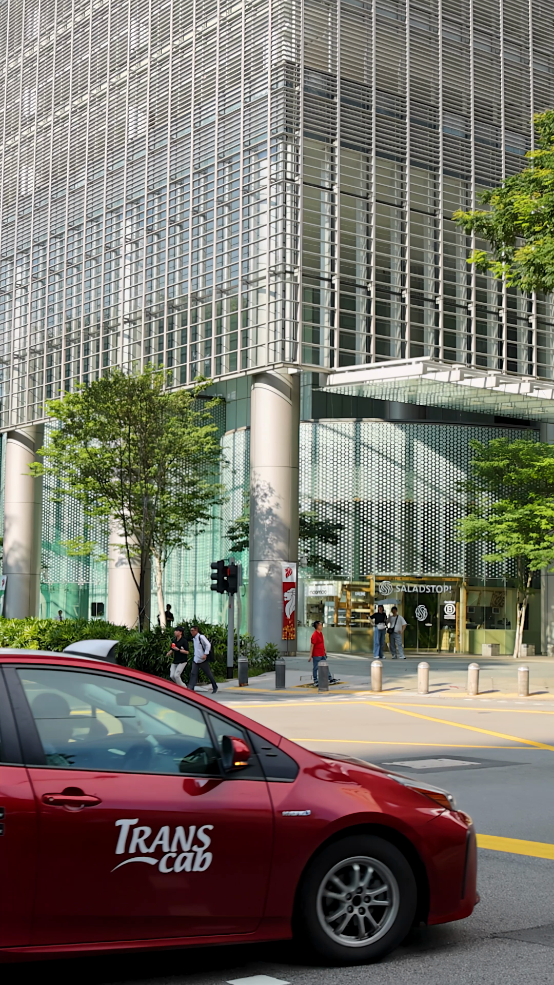 Red Taxi Passing Modern Office Building In Stock Footage SBV-353096861 ...