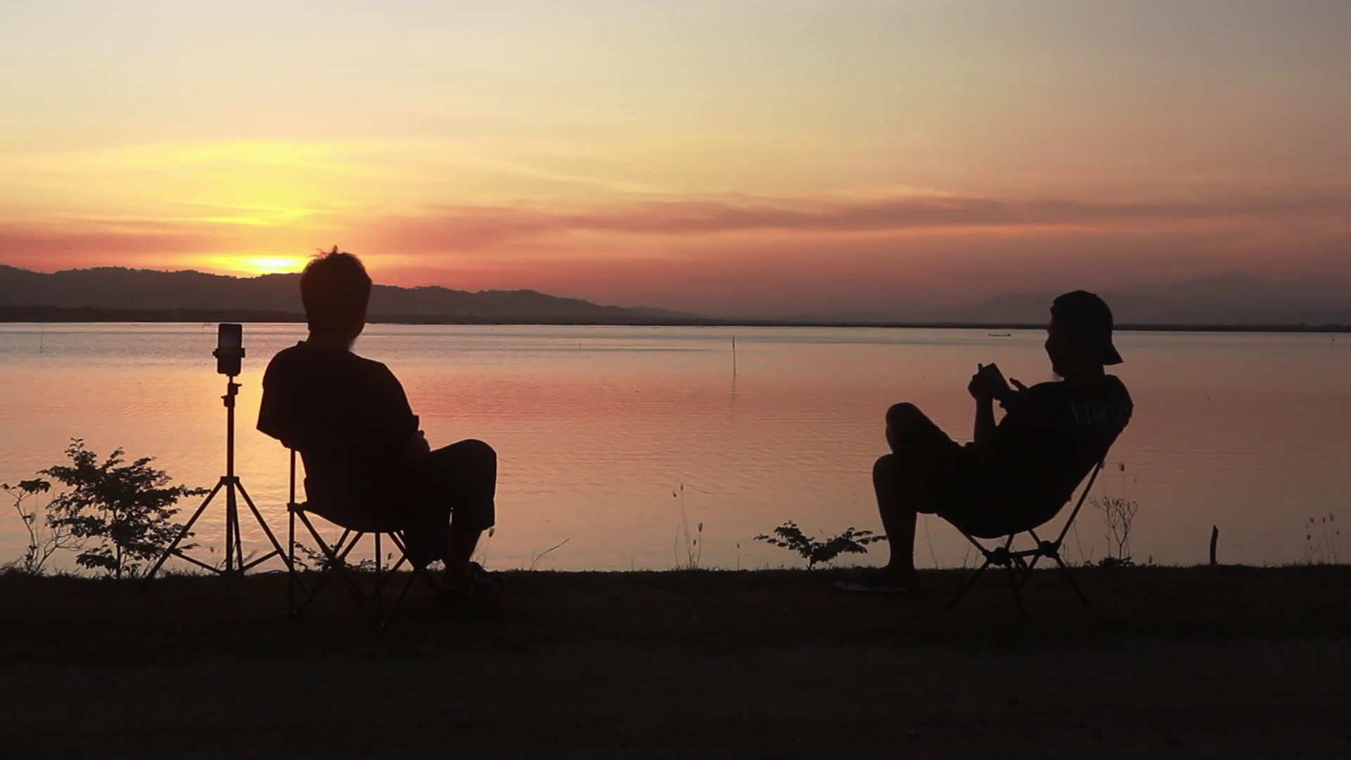 Silhouette Of Two Men With Sunset Background Stock Footage SBV ...