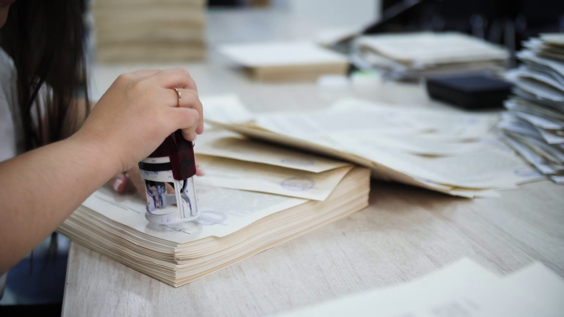 Woman Stamping Documents At Desk Stock Footage SBV-352704093 - Storyblocks