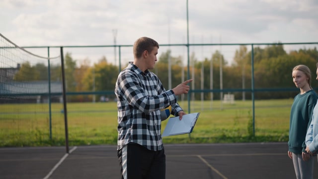 Coach Taking Notes Stock Footage: Royalty-Free Video Clips - Storyblocks
