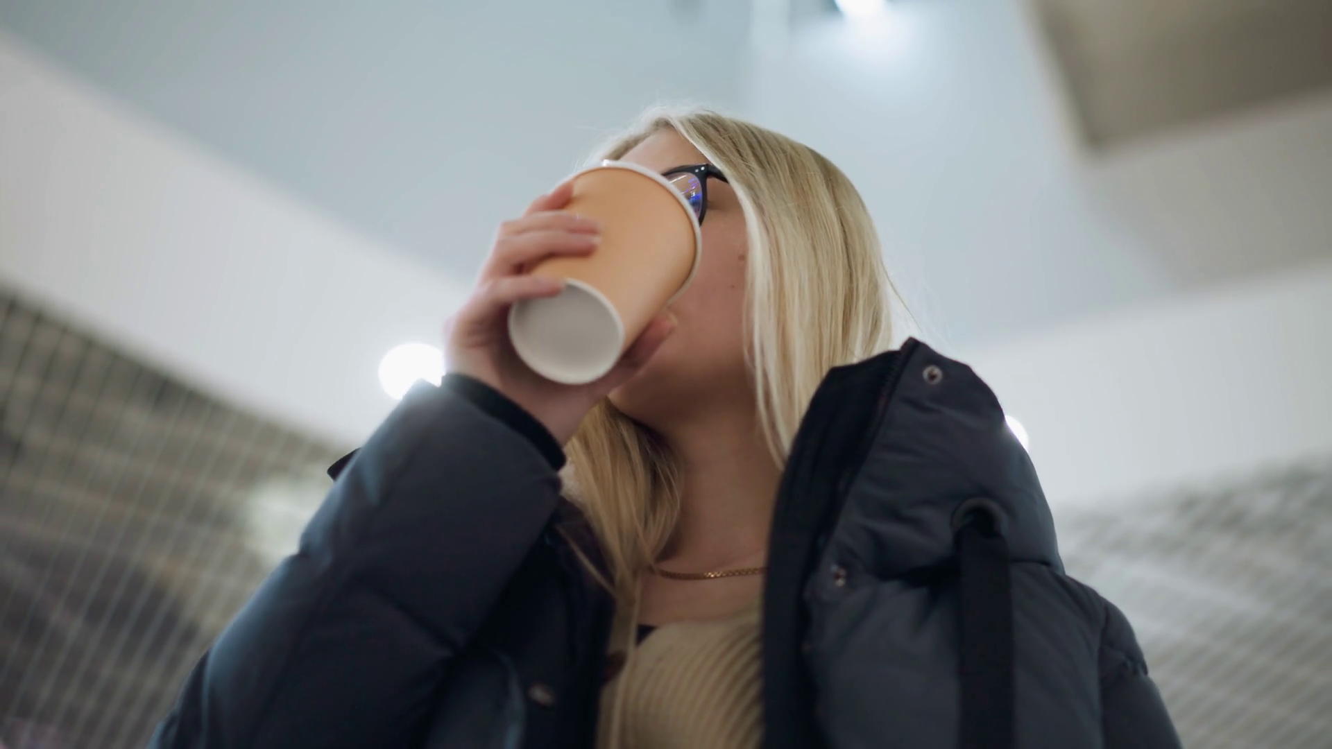 Woman Sipping Beverage In Black Jacket Stock Footage SBV-351808243 ...