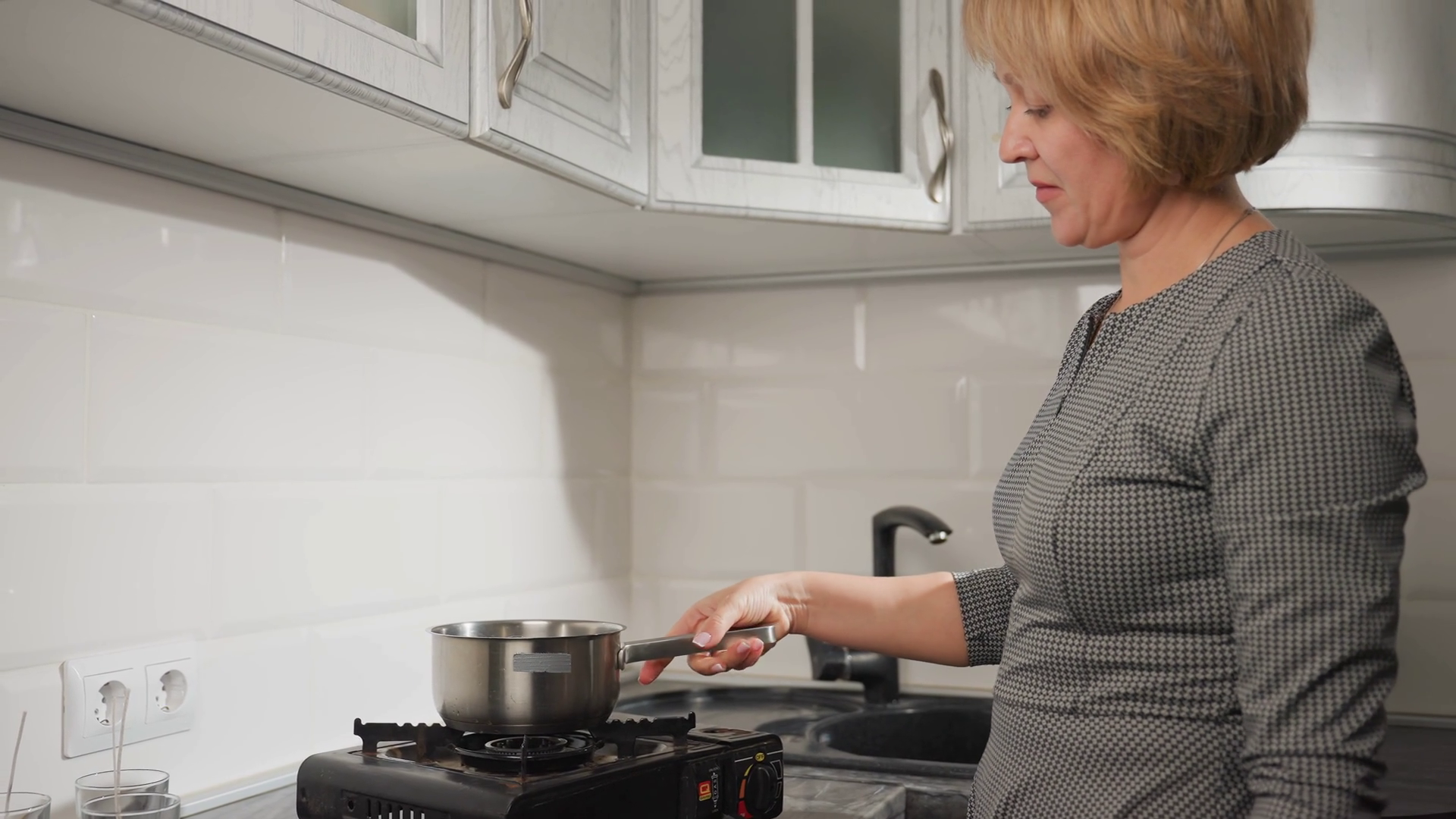 Mature Woman Preparing To Cook Carefully Stock Footage SBV-352012169 ...