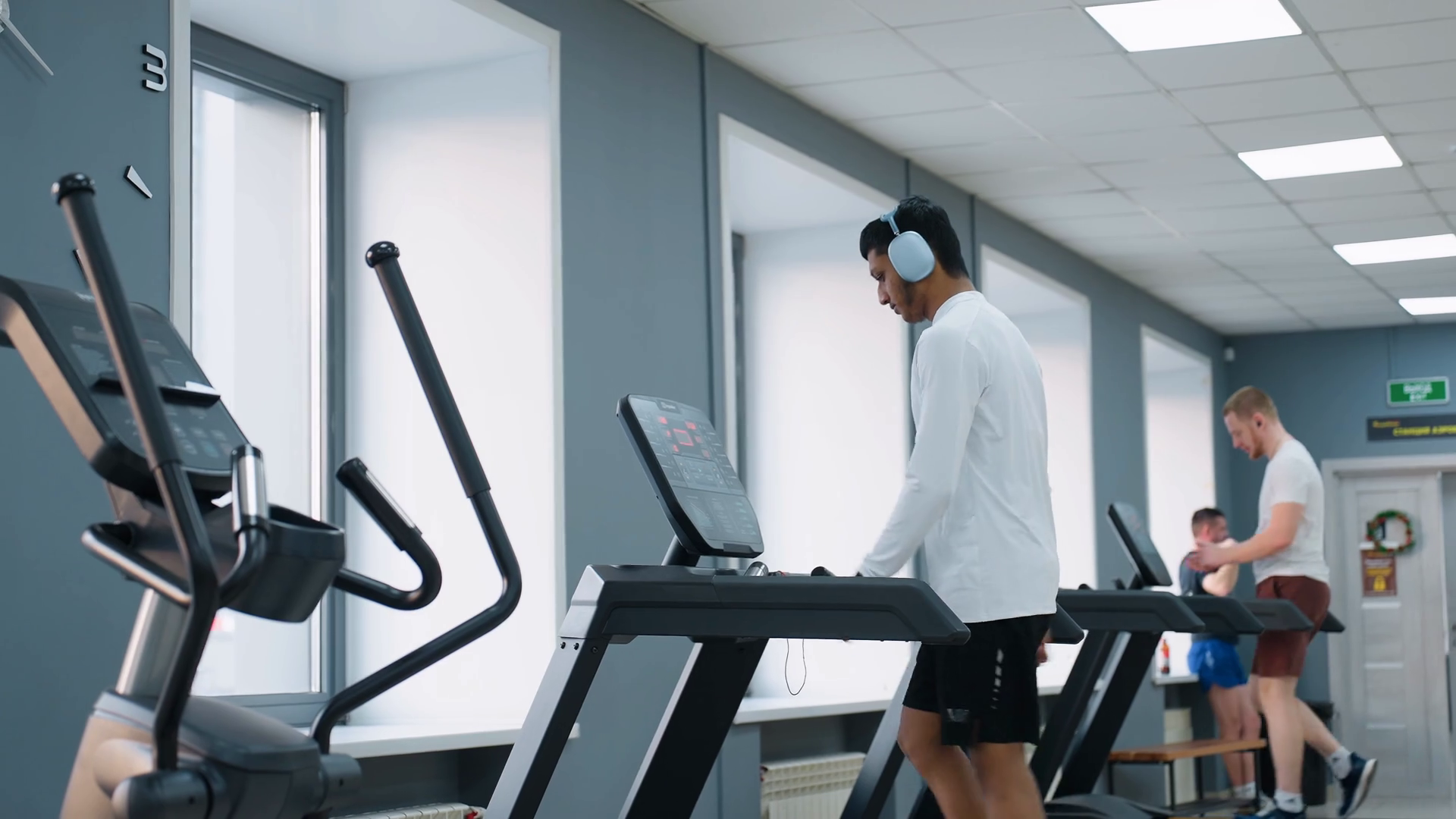Two Men In Sportswear Walking On Treadmills Stock Footage SBV-352111950 ...