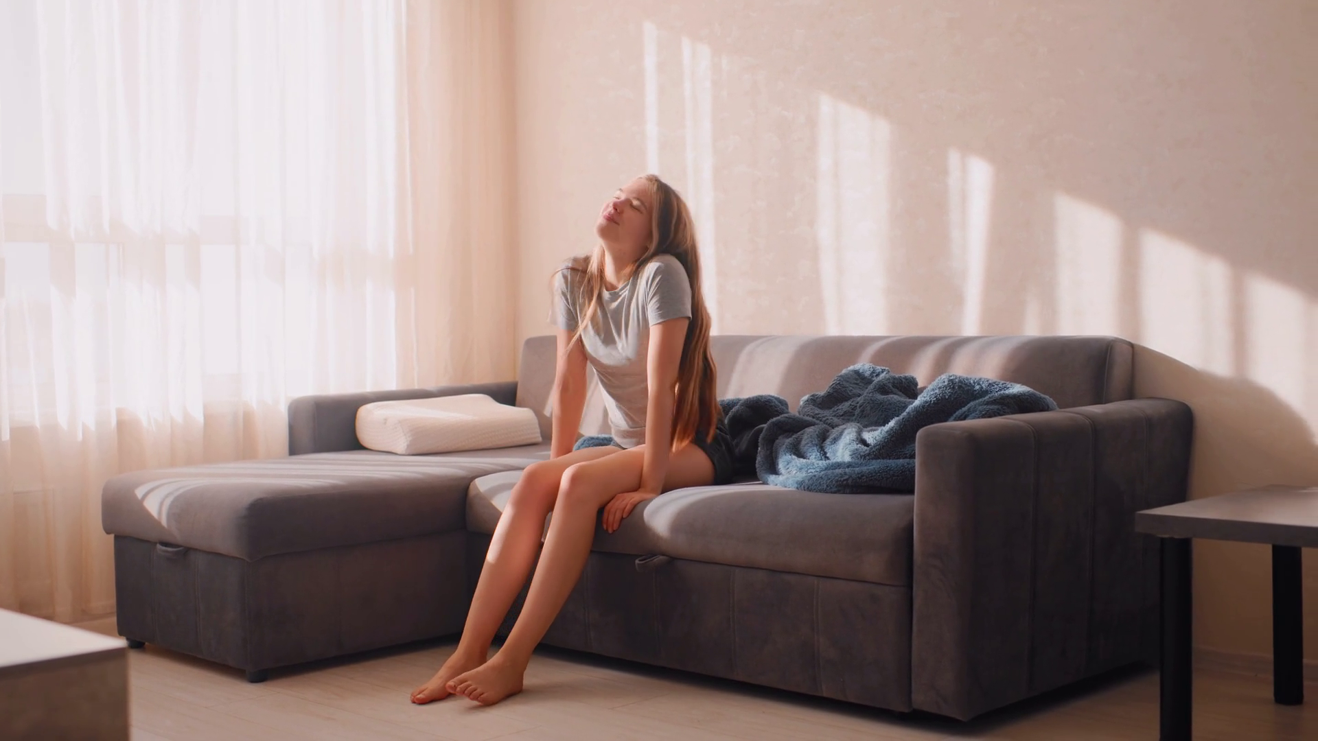 Lady Seated On Couch In Bright Room Wiggles Stock Footage SBV-352967170 ...