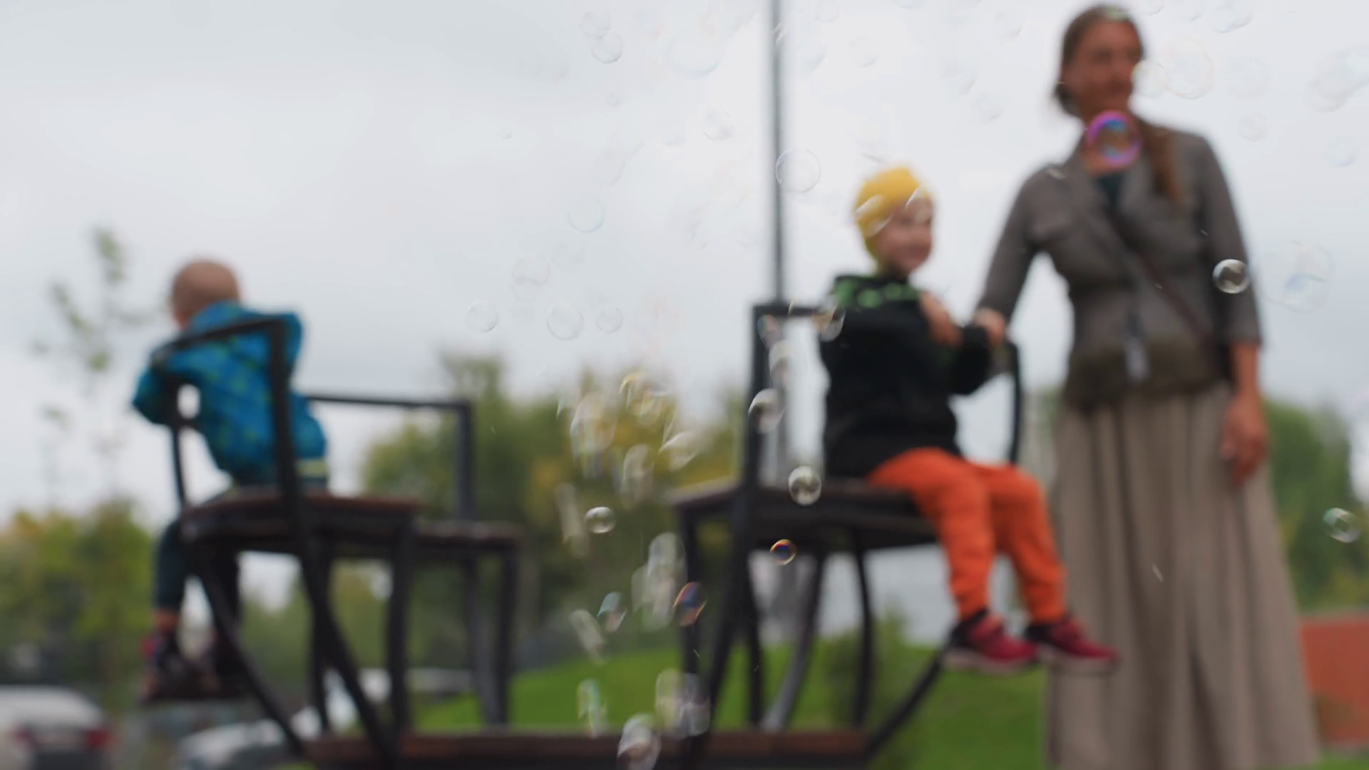 Blur Background Shows Aunt Spinning Two Kids Stock Footage SBV ...