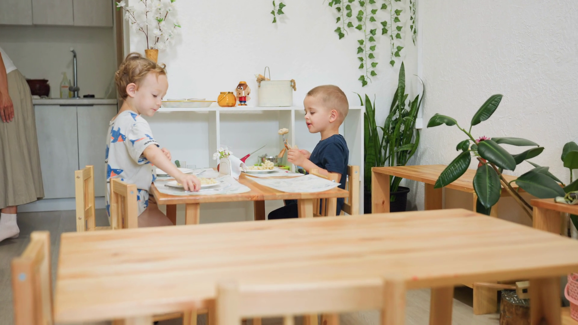 Two Boys Sit Across At Wooden Table Eating Stock Footage SBV-353005838 ...