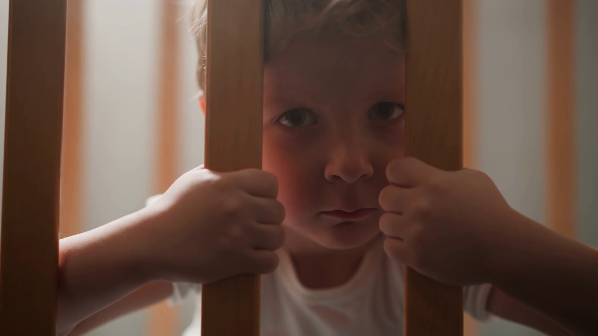 Scared Little Boy Grabs Wooden Bars Of Crib Stock Footage SBV-347710800 ...