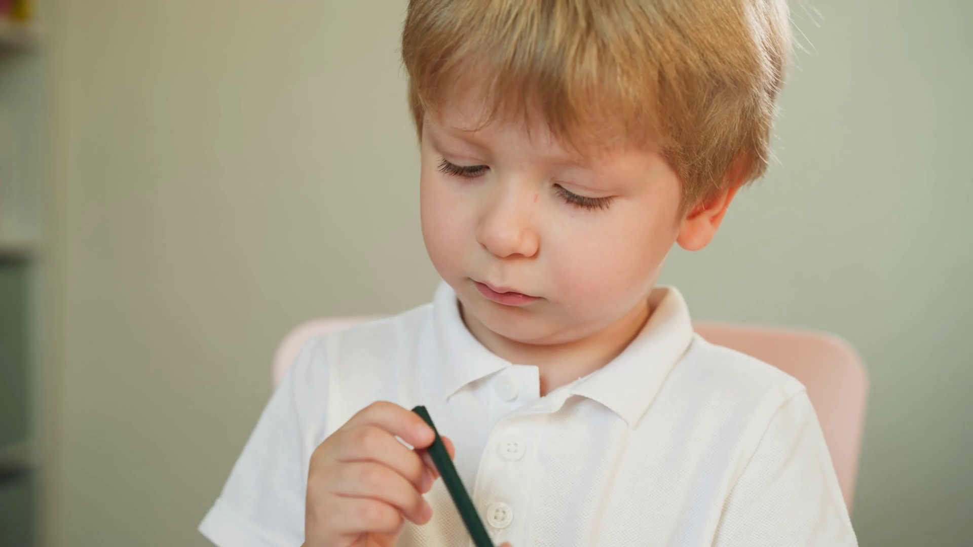 Serious Toddler Boy Studies Green Crayon Stock Footage SBV-348400124 ...