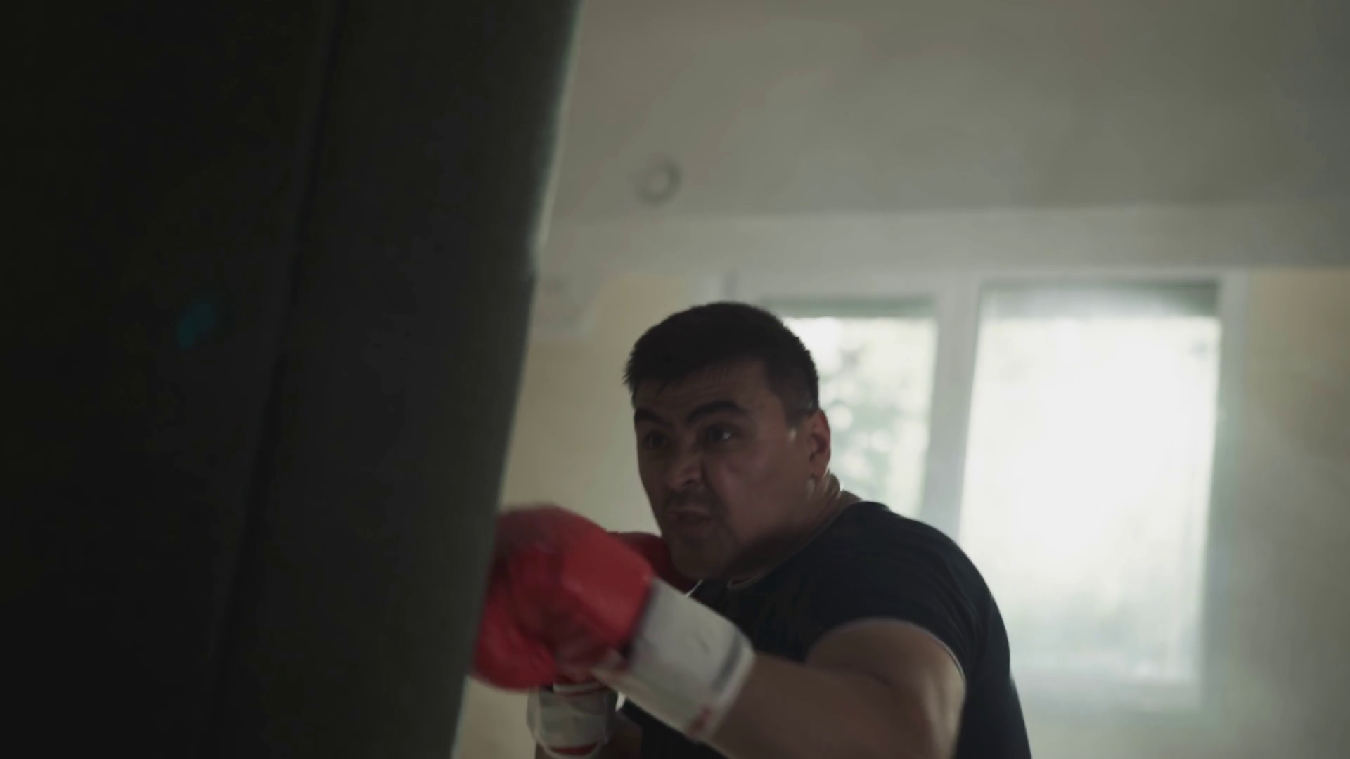 Strong Man Hits Punching Bag Arms With Stock Footage SBV-348690223 ...