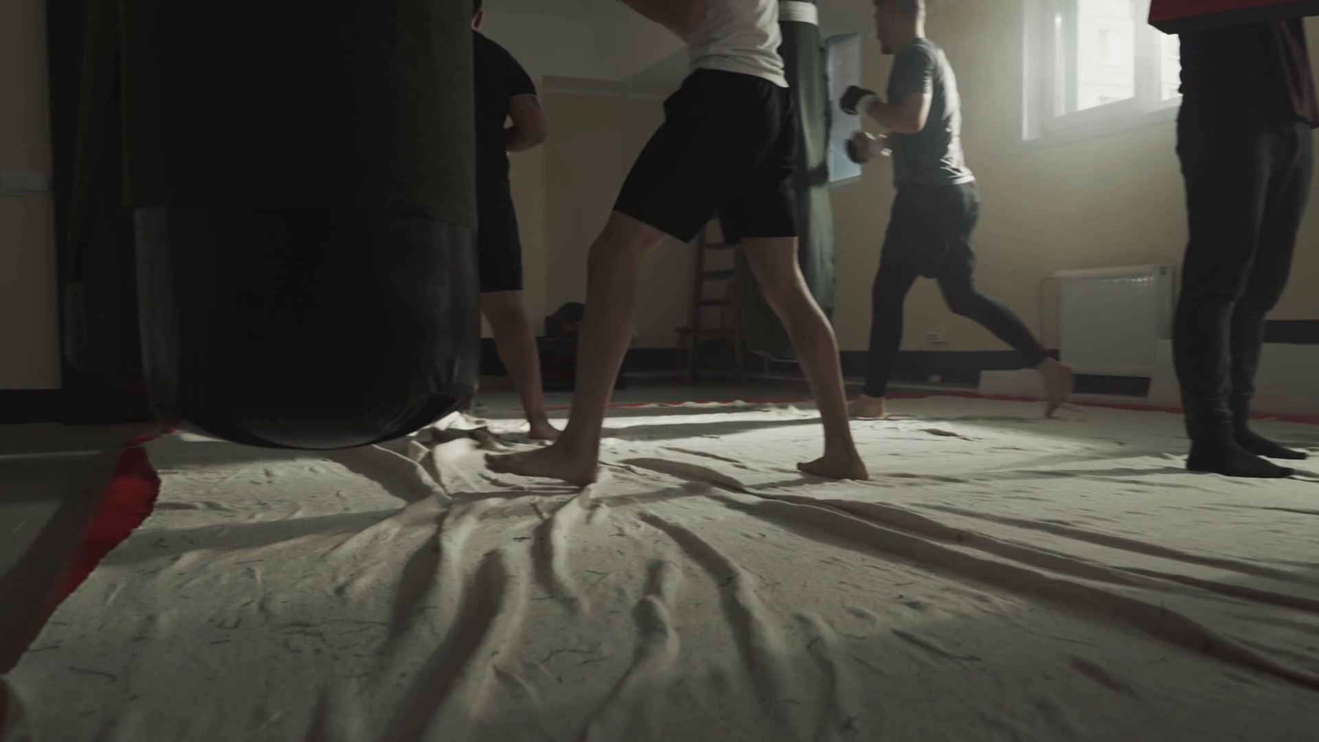Men Group Exercises With Punching Bags In Stock Footage SBV-348690414 ...