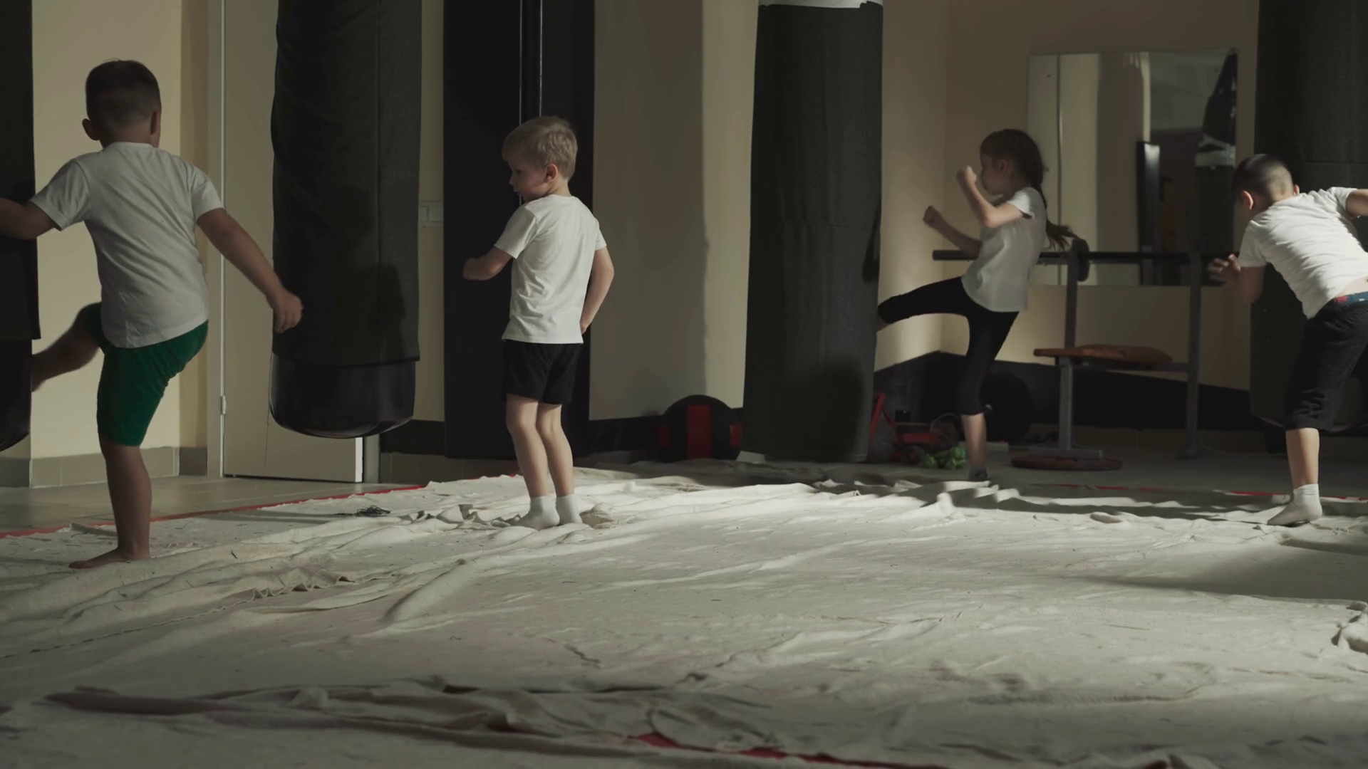 Kids Kicking Punching Bags In Gym Martial Stock Footage SBV-348690590 ...