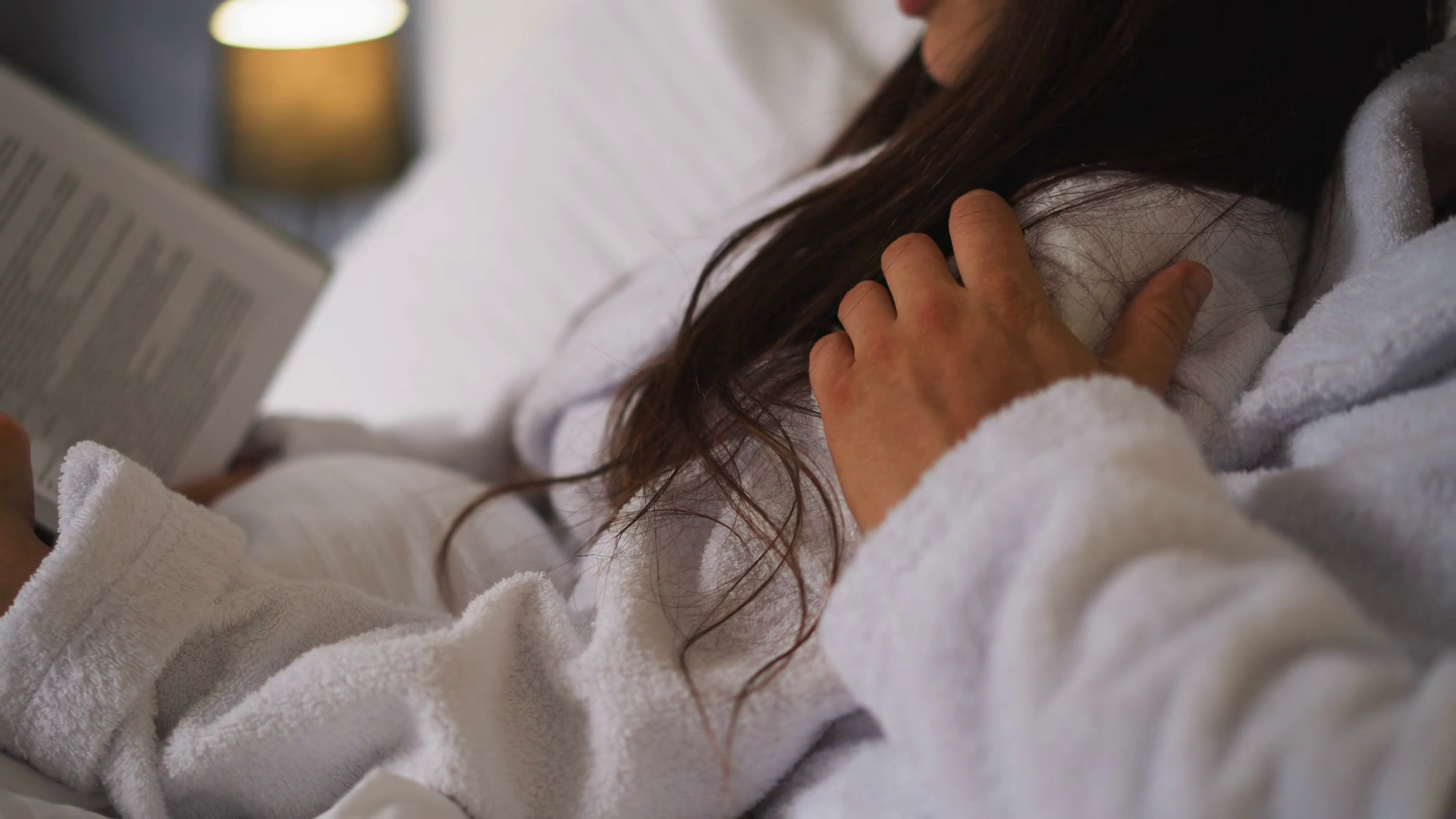 Man Hugs Woman Reading Book In Bed Closeup Stock Footage SBV-348754450 ...