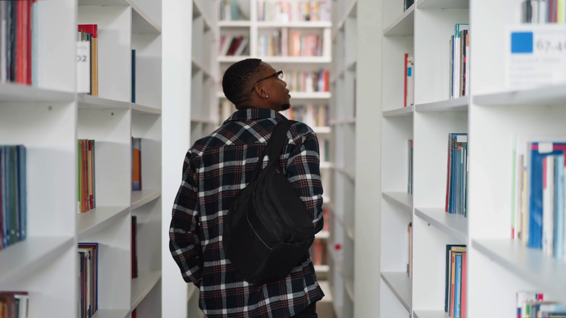 Student Walks Along Aisle In Public Library Stock Footage SBV-348760690 ...