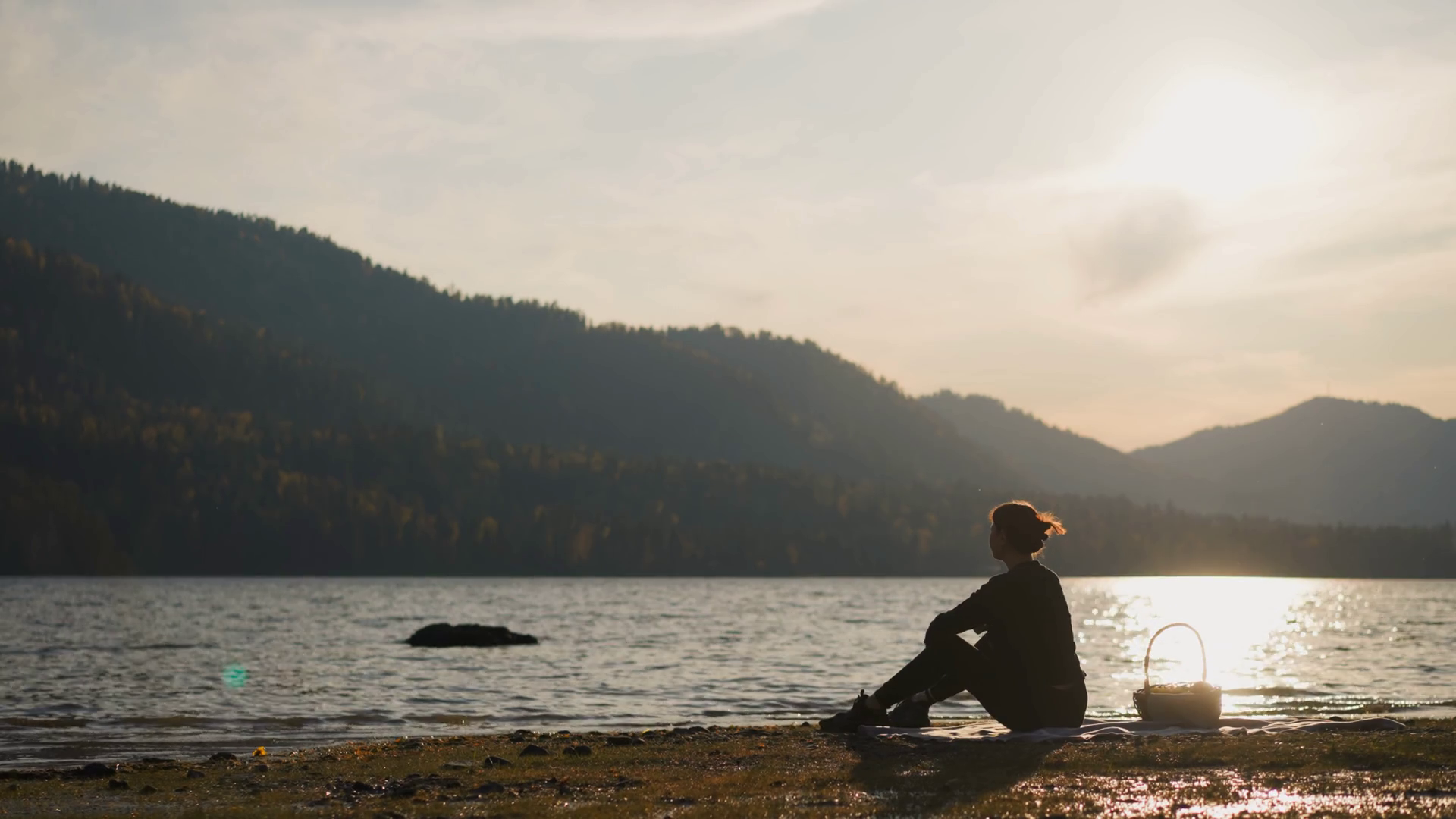 Woman Throws Rock Into Water Of Lake At Stock Footage SBV-348728326 ...