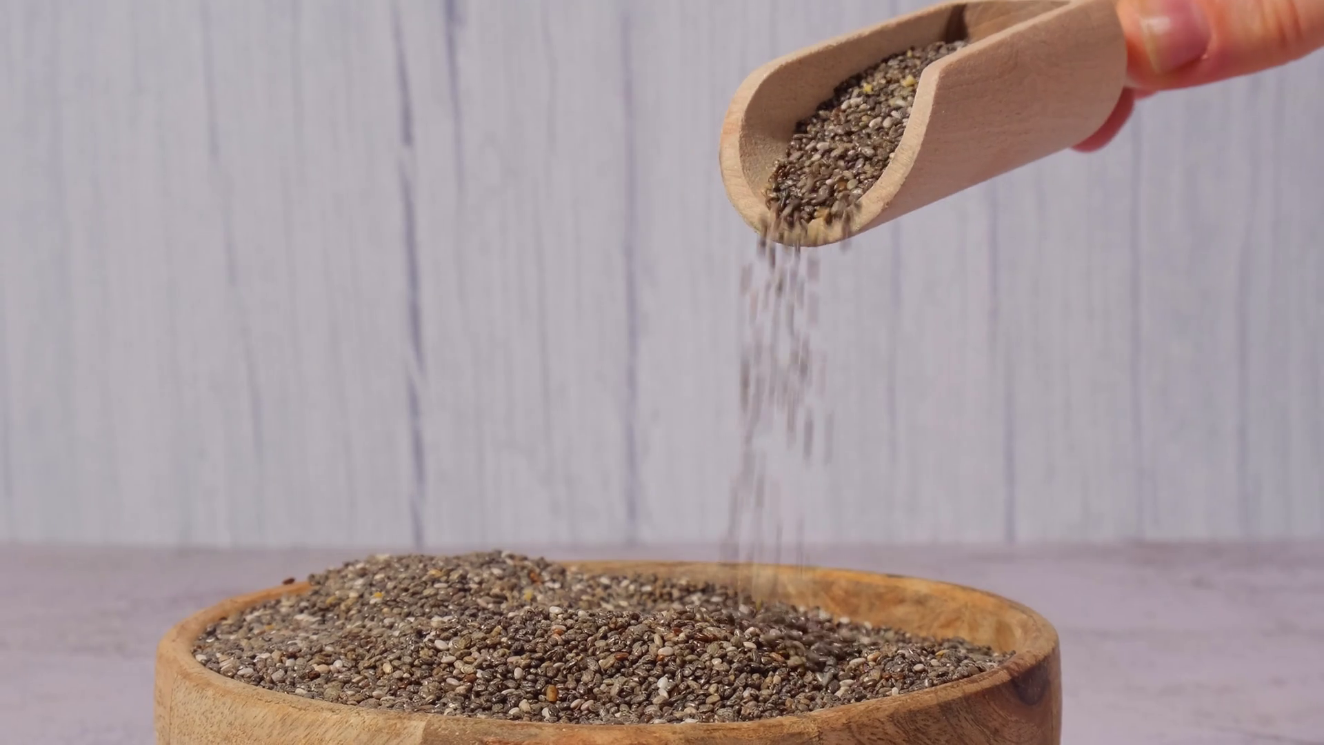 Slow Motion Chia Seeds Fall In Wooden Bowl Stock Footage SBV-347656843 ...