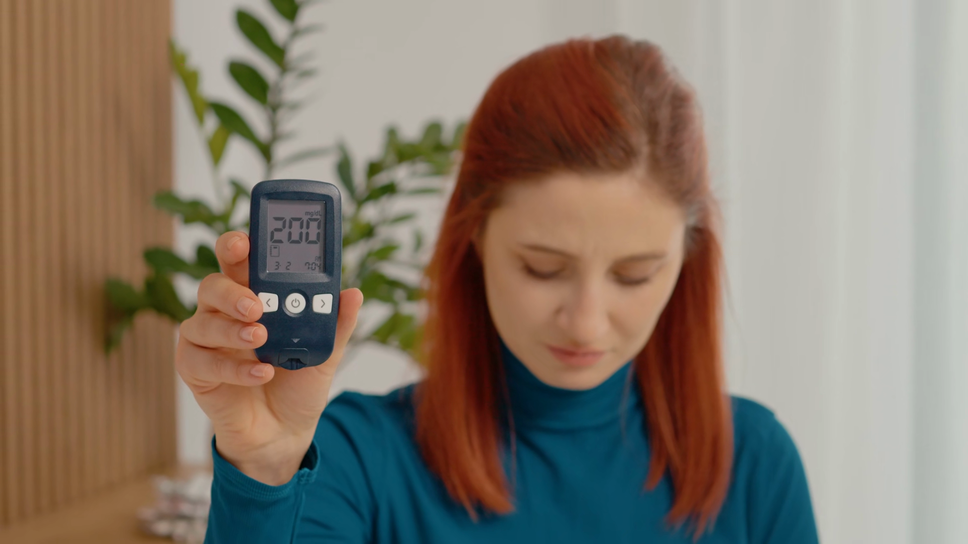 A Woman Looks At Glucometer Reading Of 200 Stock Footage SBV-353800581 ...