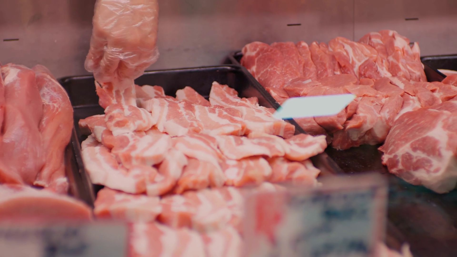 Close-up Of Salesman Lays Out Raw Meat Into Stock Footage SBV-351672946 ...