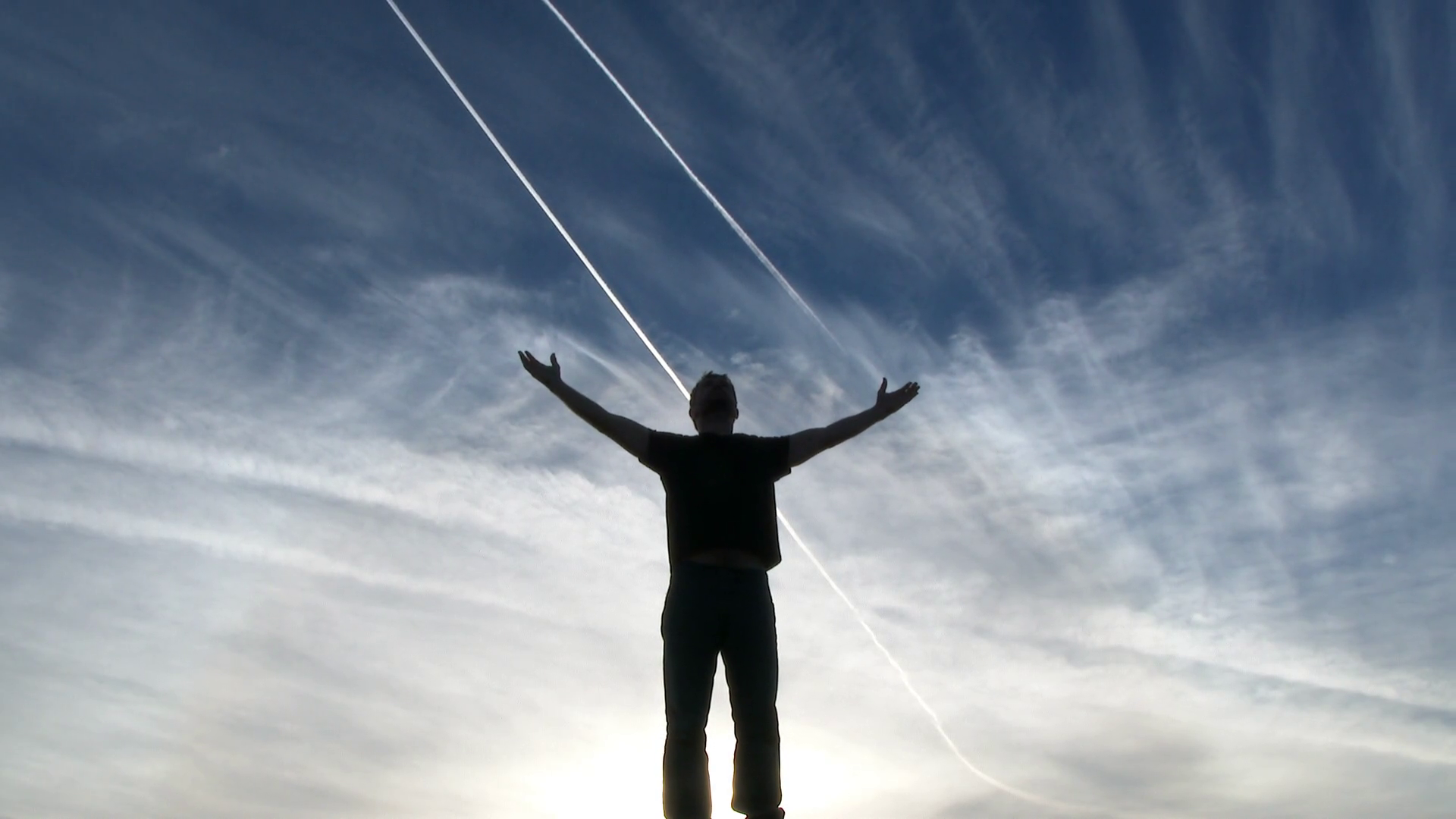 Silhouetted Person With Arms Raised To Blue Sky Stock Video Footage ...