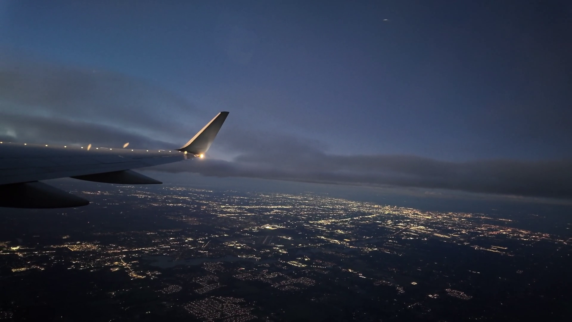 Airplane Flying Over Major City At Dusk Stock Footage SBV-352784250 ...