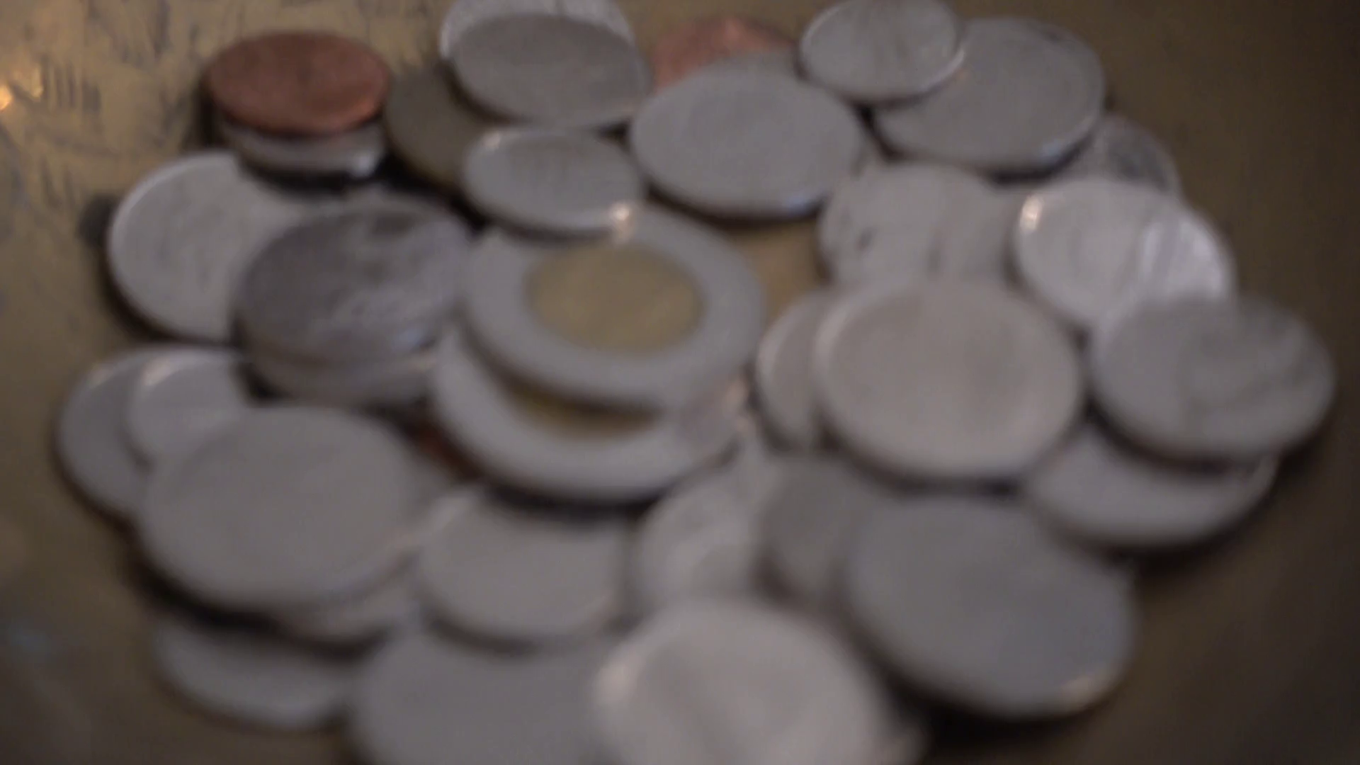 A Bowl Of Coins Is Moving Around During Stock Footage SBV-348383520 ...