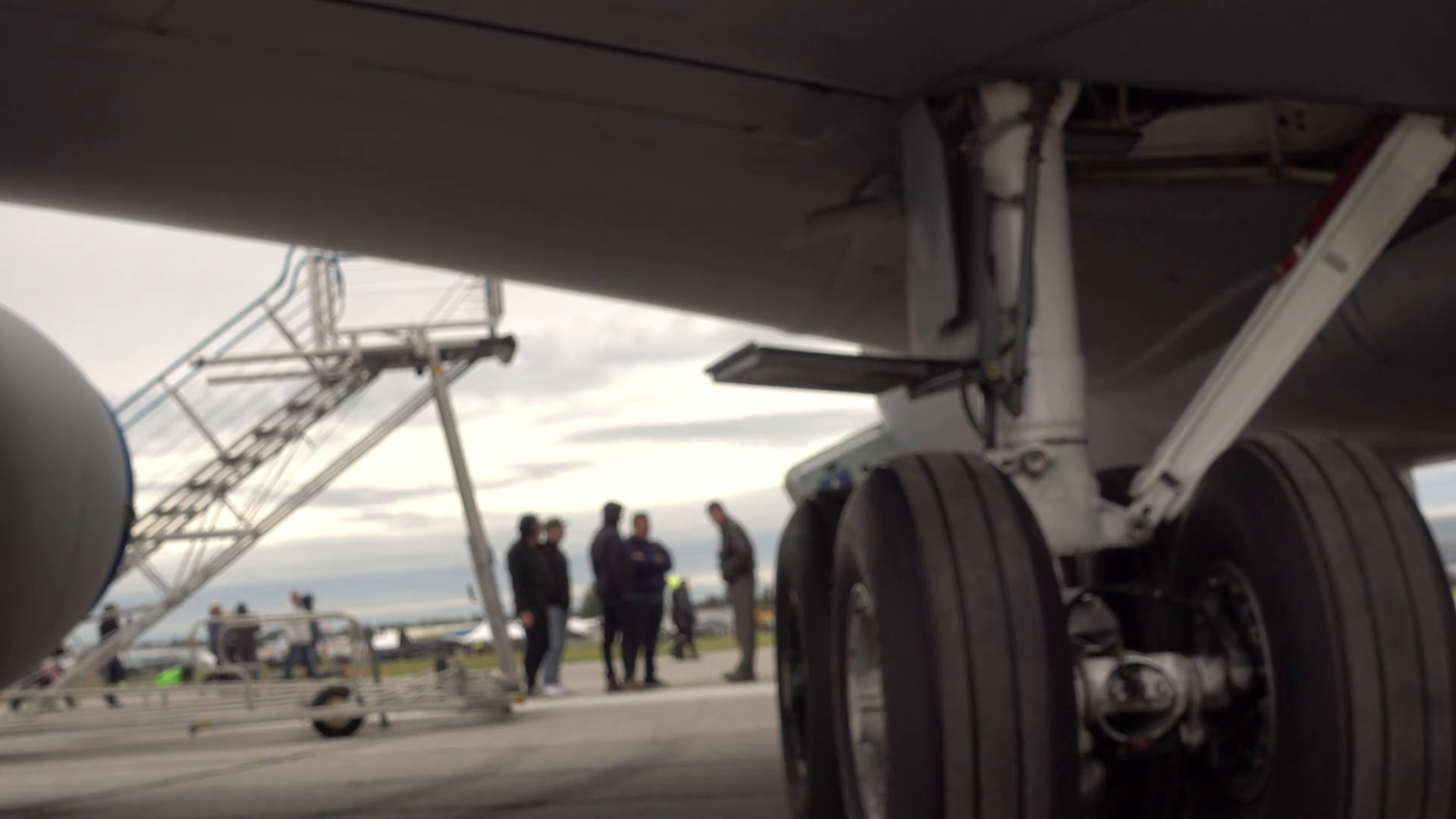 Closeup Of Aircraft Landing Gear With People Stock Footage SBV ...