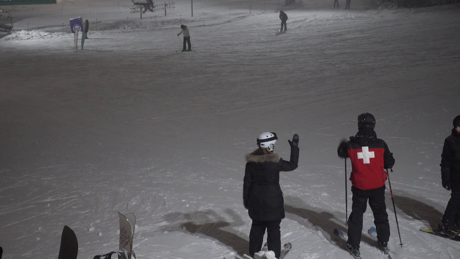 At Night Ski Coach Patrols In Snow Assisting Stock Footage SBV ...