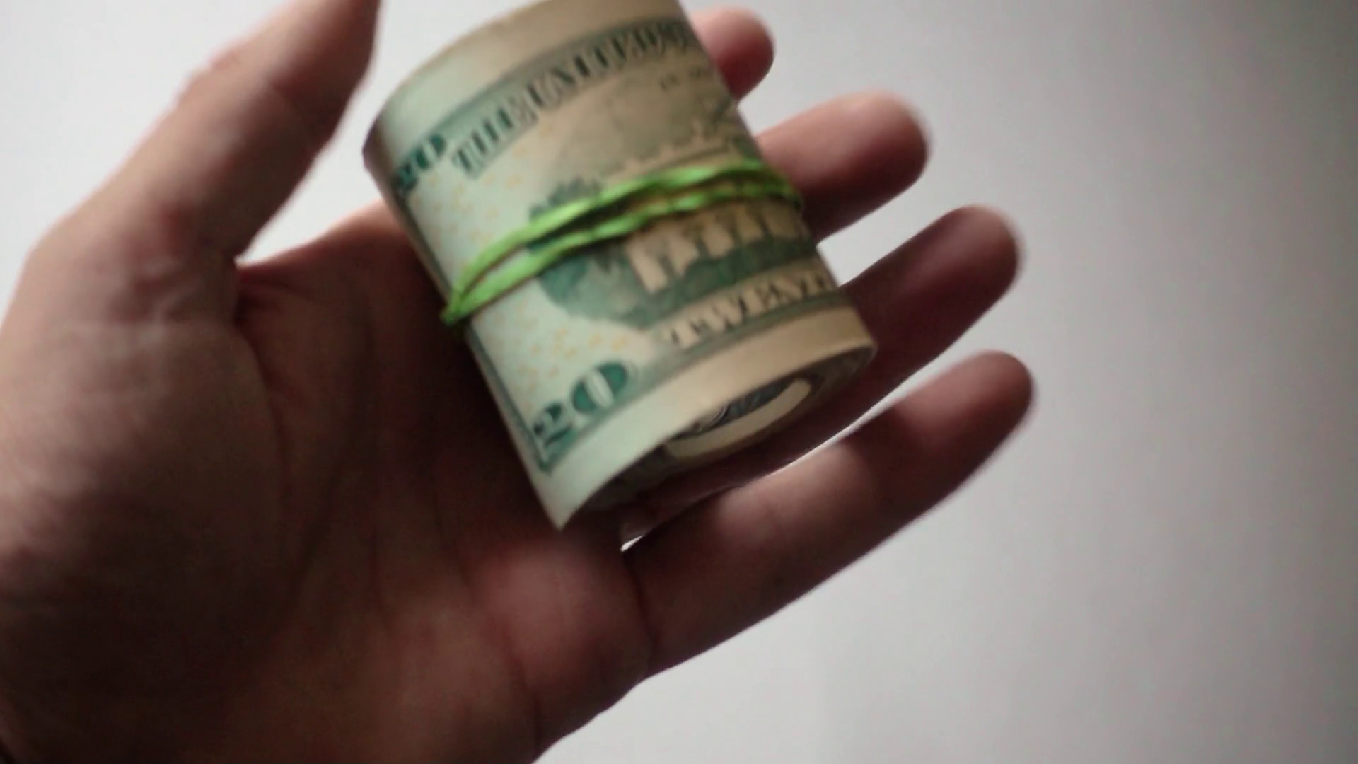 In Slow Motion Roll Of Cash In Hand Bounces Stock Footage SBV-348383450 ...