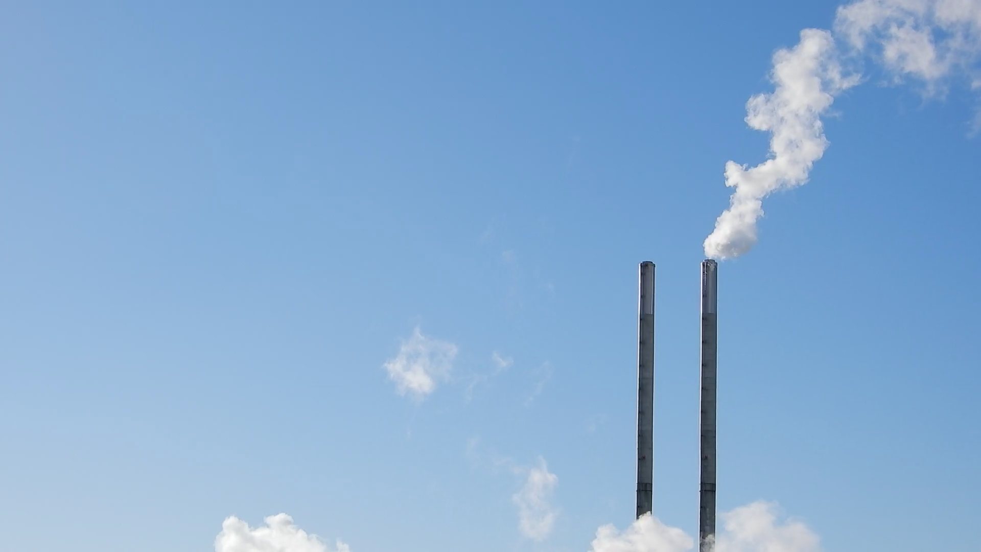 Two Long Skinny Smokestacks Against Clear Stock Footage SBV-347762883 ...